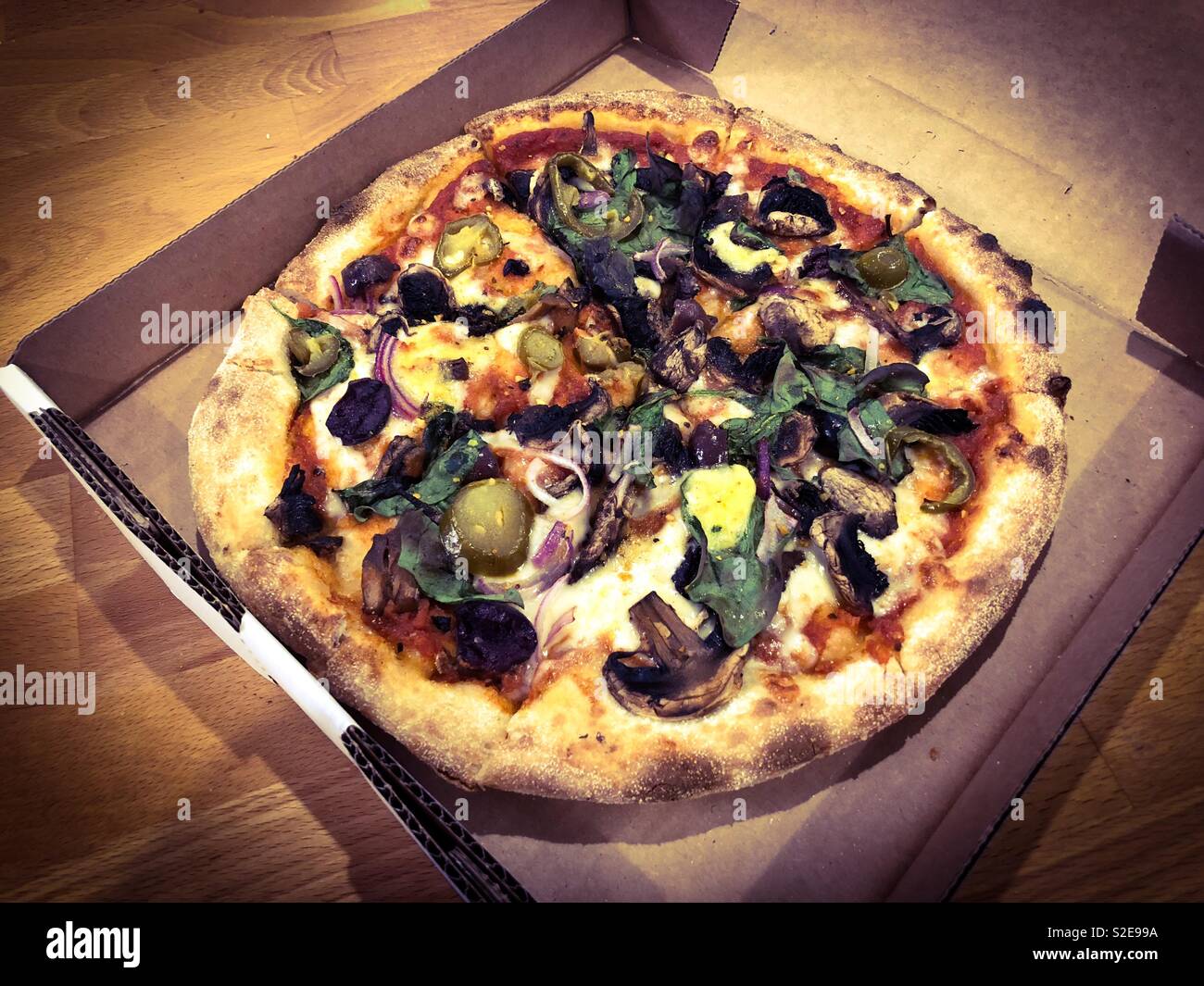 Italian vegetarian pizza made the traditional way in a wood fired oven ...