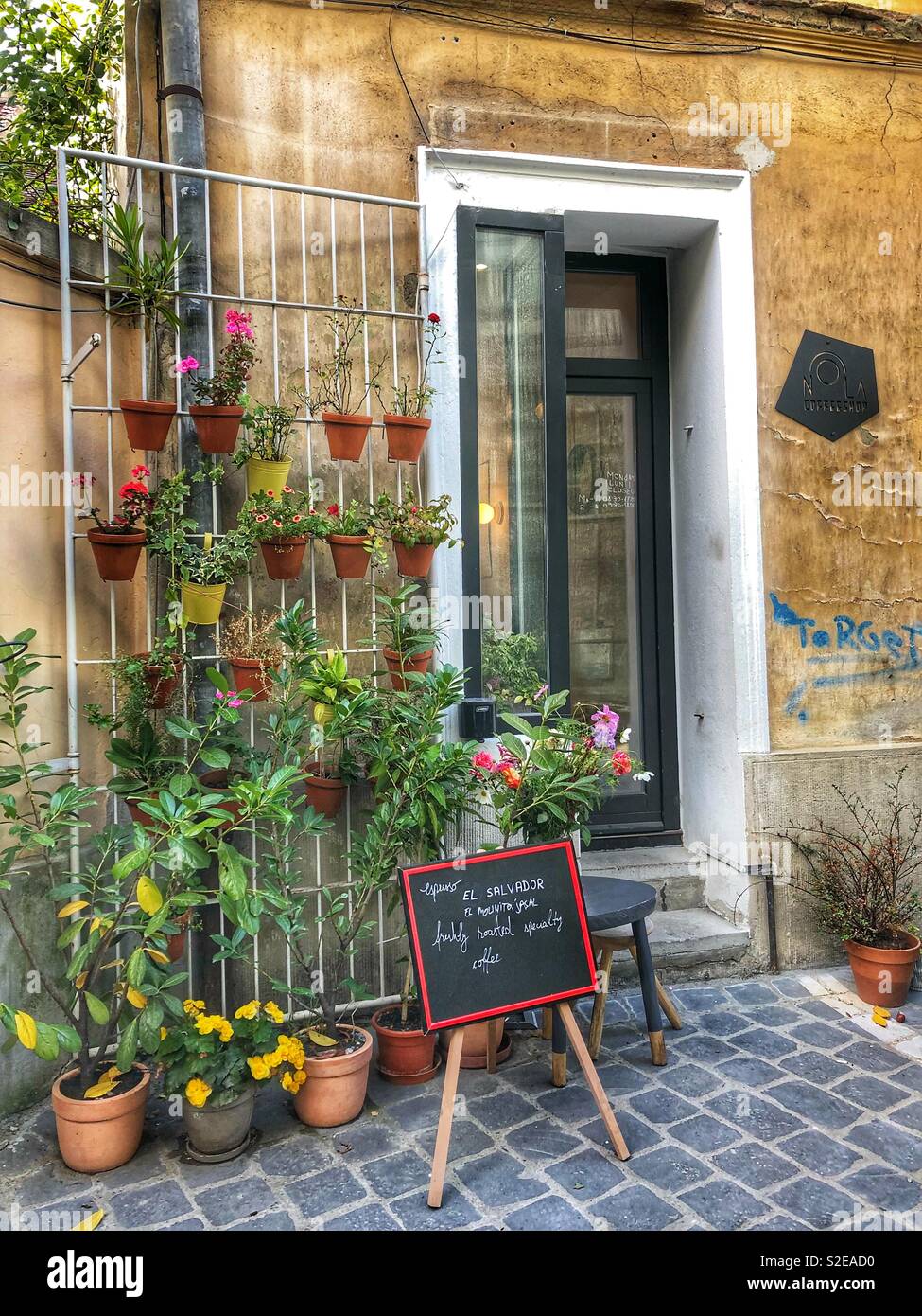 Entrance to a coffee shop in Brasov, Romania Stock Photo - Alamy