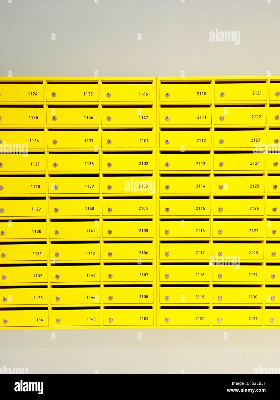 Yellow mail boxes in a new building Stock Photo - Alamy