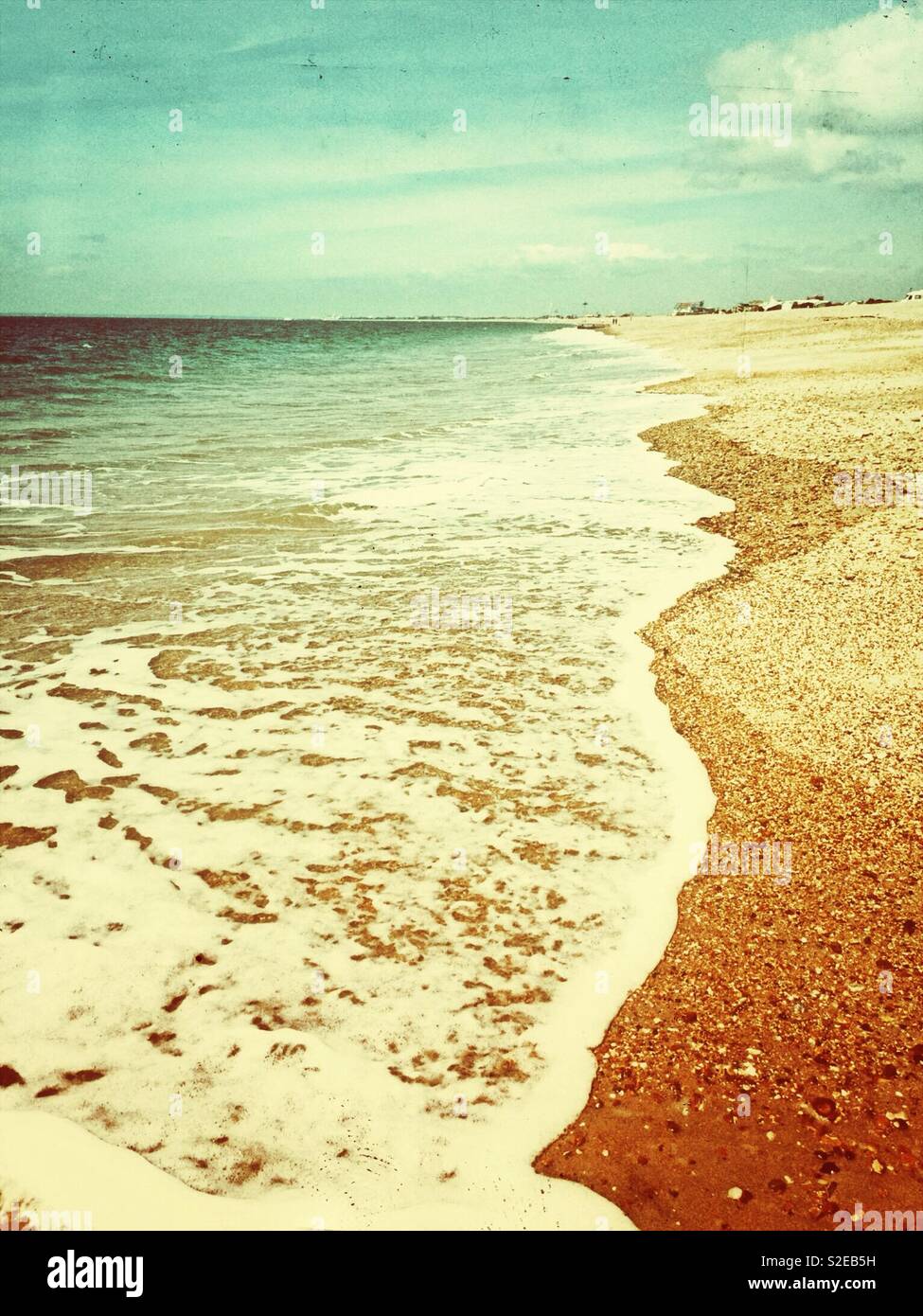 Waves breaking on a shingle beach Stock Photo - Alamy