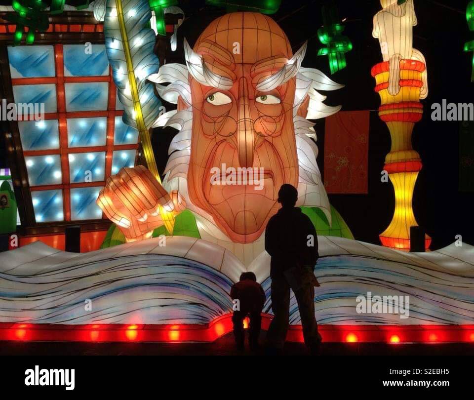 Giant Scrooge dwarfs father and son Stock Photo - Alamy