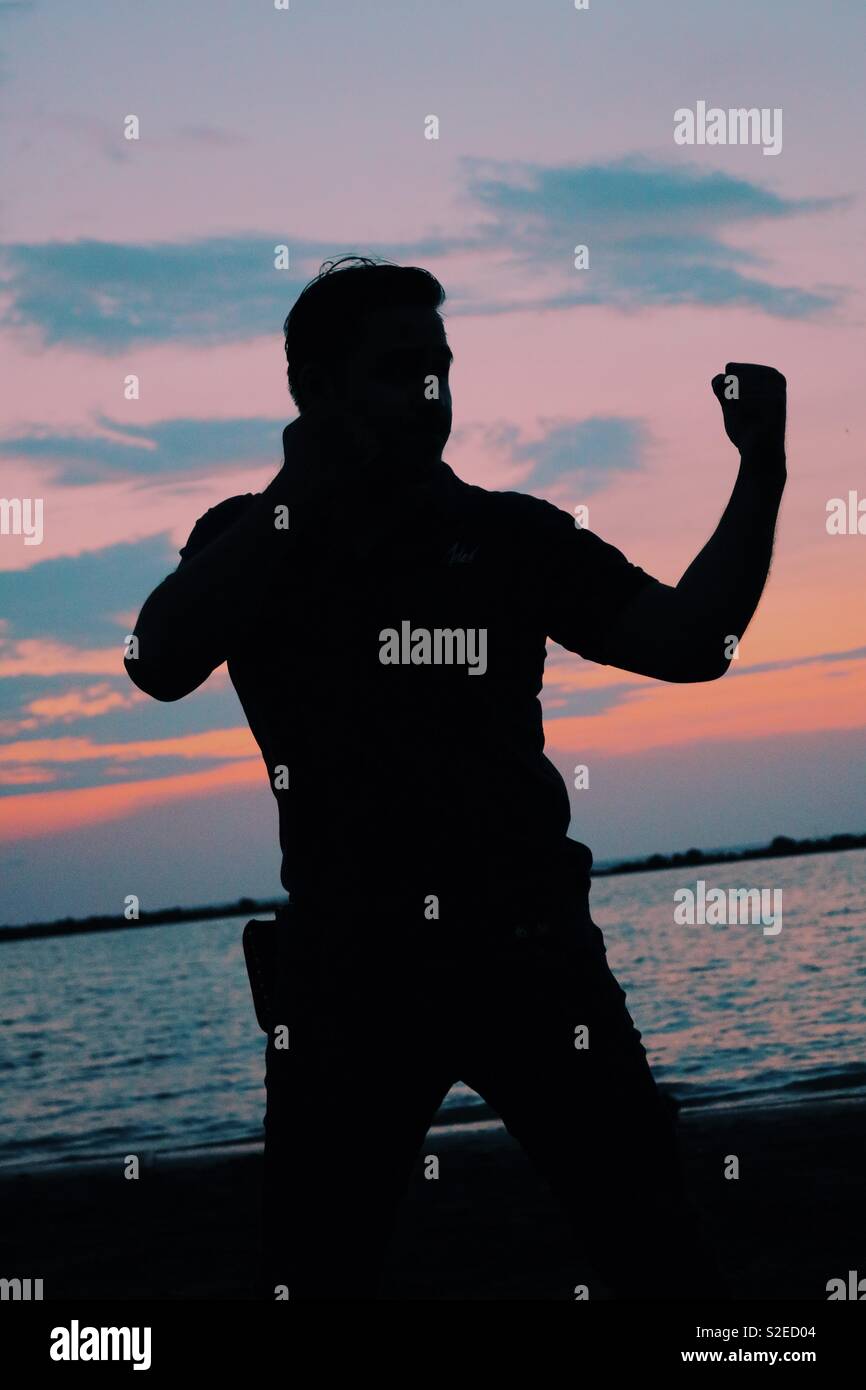 Man behind the sunset Stock Photo - Alamy