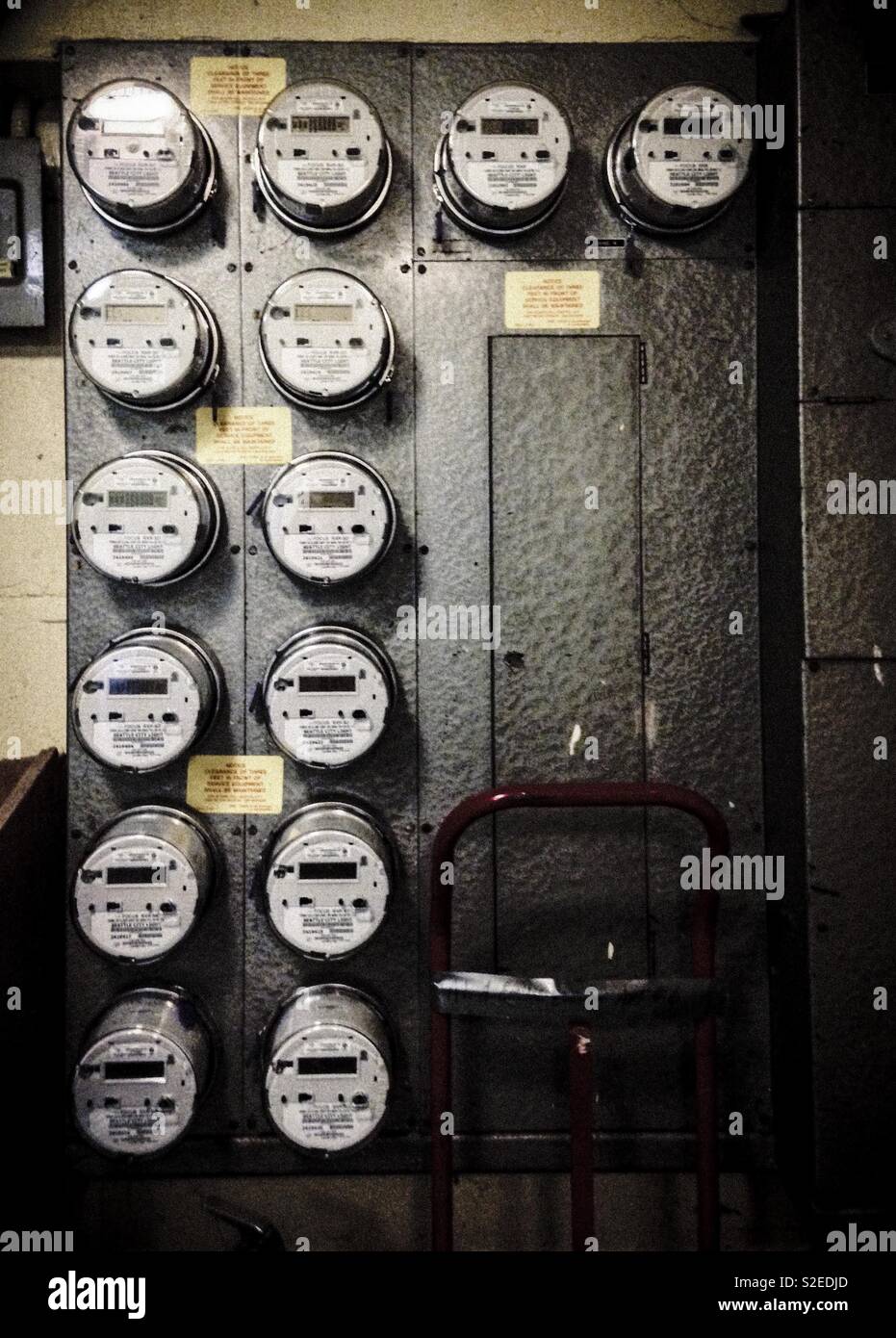 Power meters and hand truck in basement of apartment building Stock ...