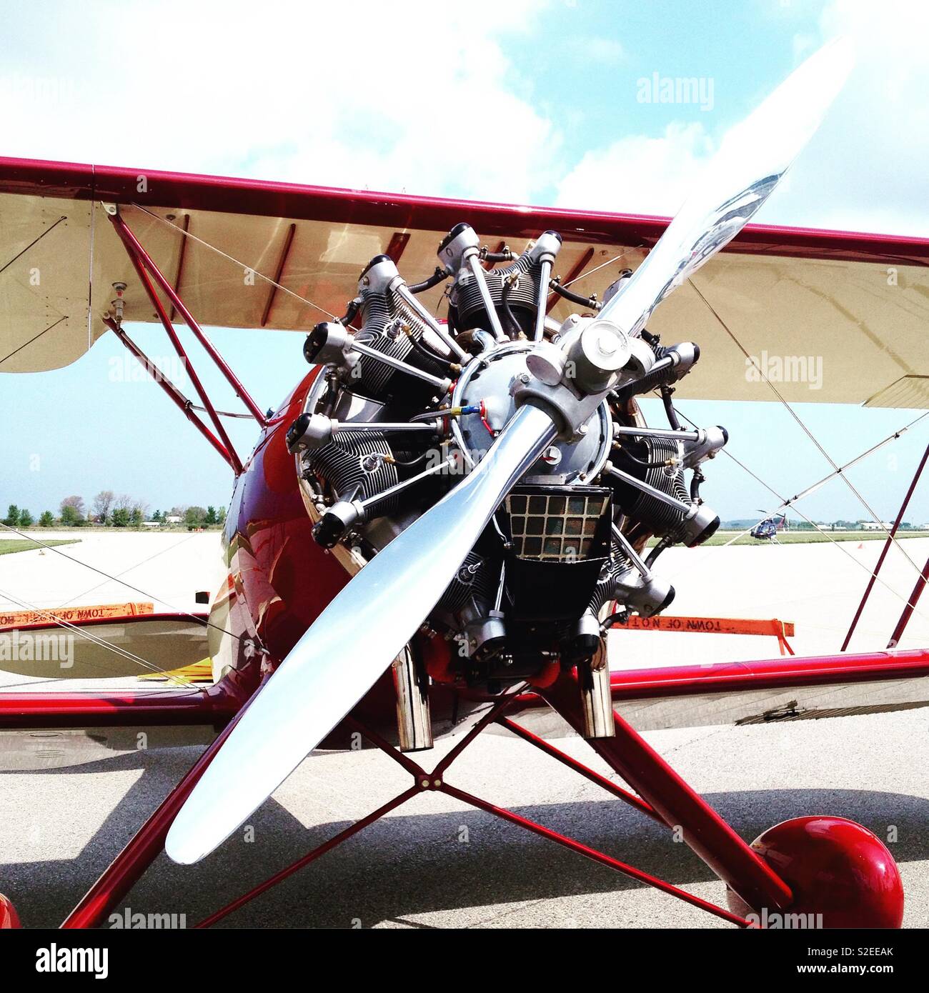 Red biplane with propeller Stock Photo - Alamy