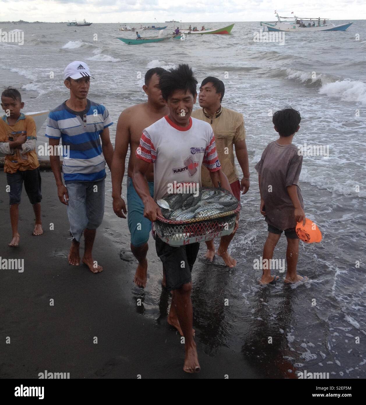 Fisherman activity at fish market, Galesong, South Sulawesi, Indonesia ...