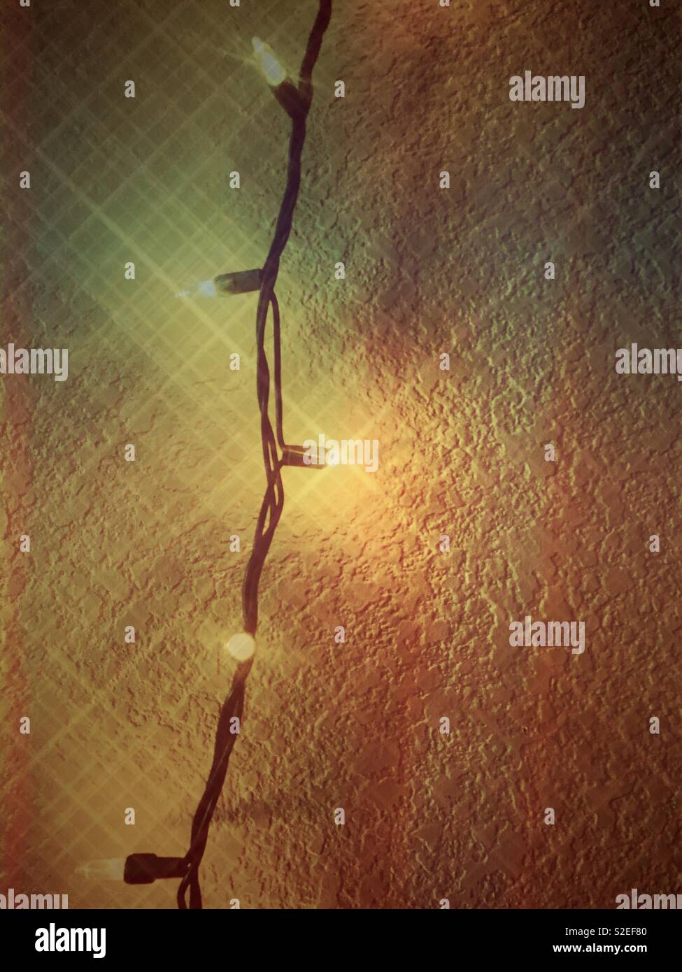 Christmas glowing white lights on a single strand Stock Photo - Alamy