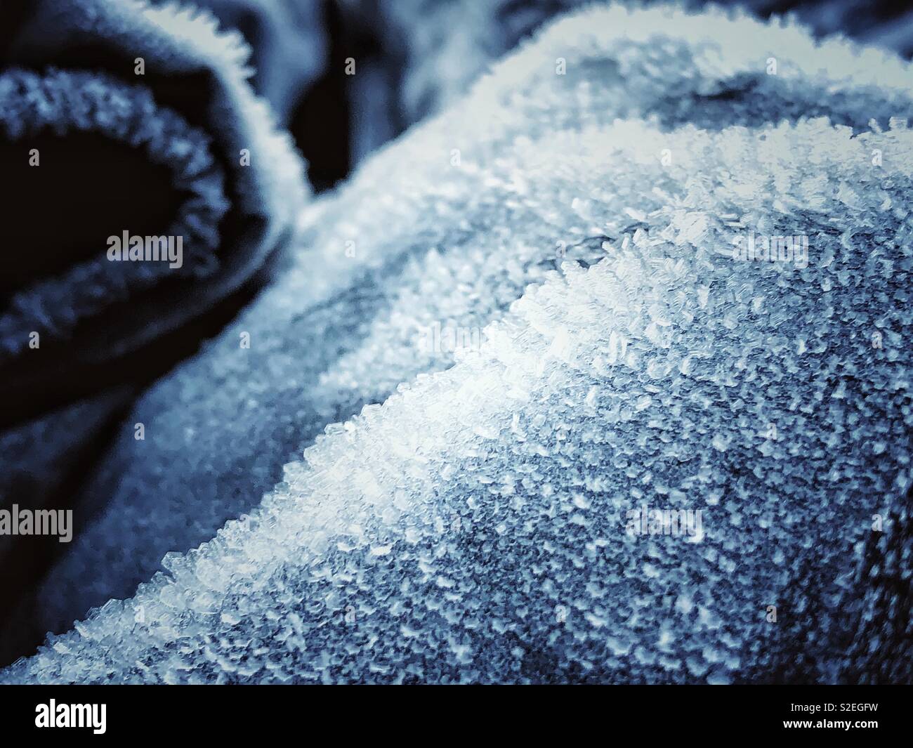 Ice crystals on Forgotten jacket frozen on the sidewalk Stock Photo - Alamy