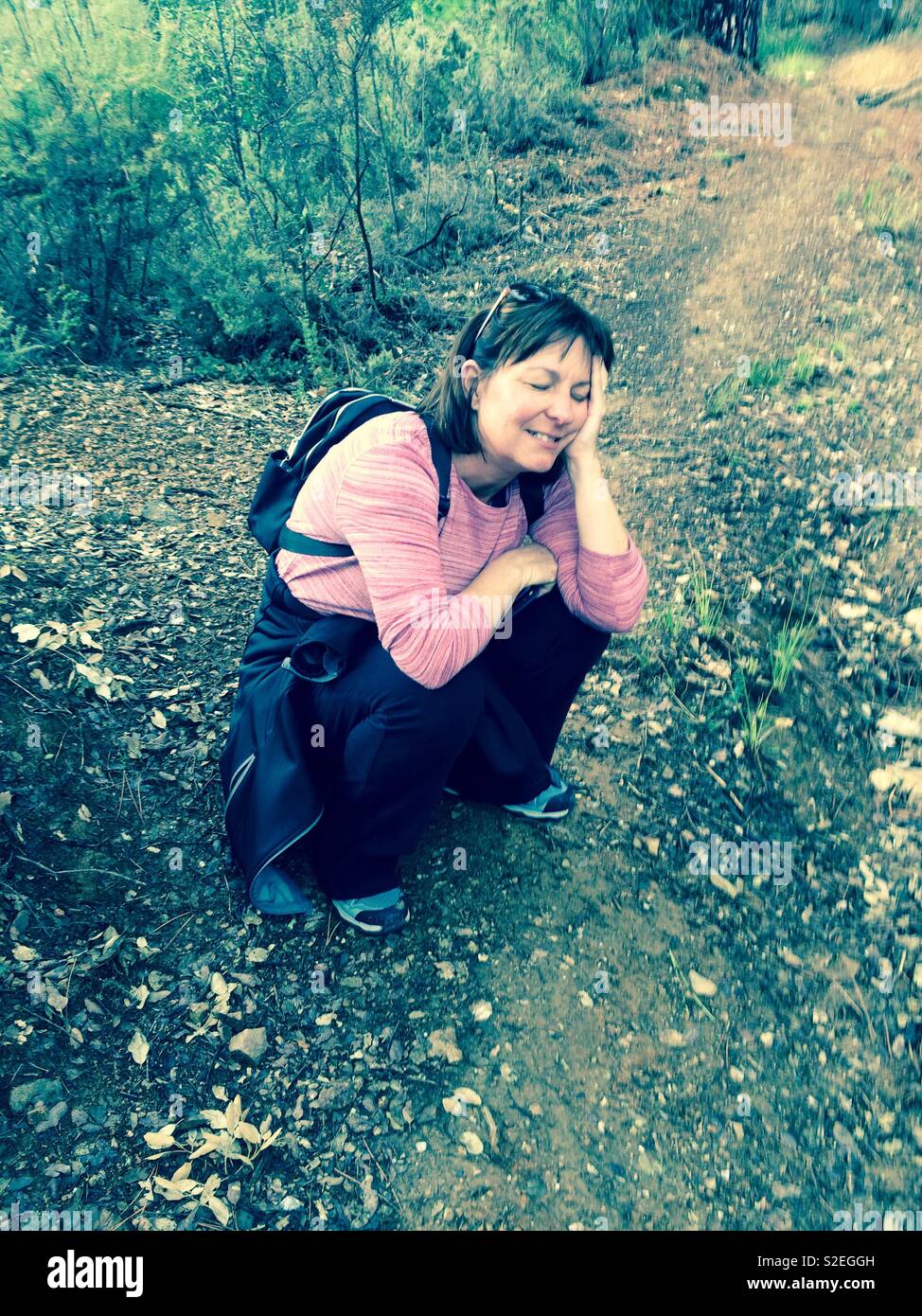 Woman lady female crouching smartphone stock photos and images - Alamy