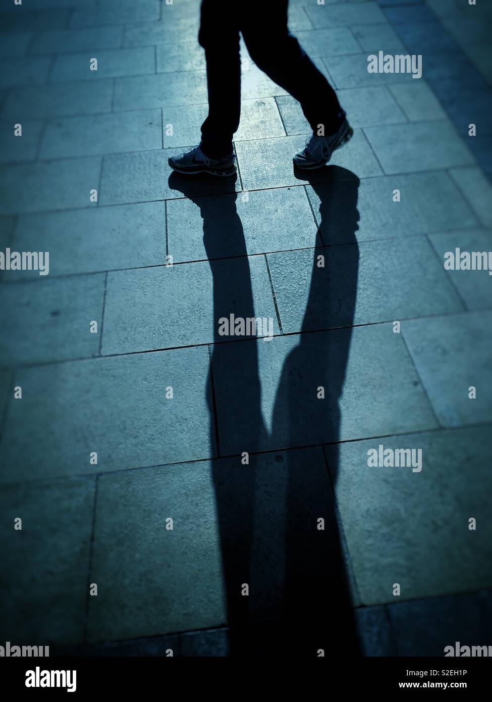 Man walking on paving hi-res stock photography and images - Alamy