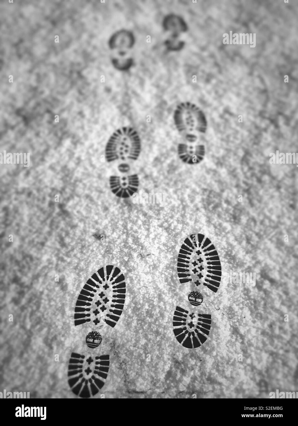 Walking footprints Black and White Stock Photos & Images - Alamy
