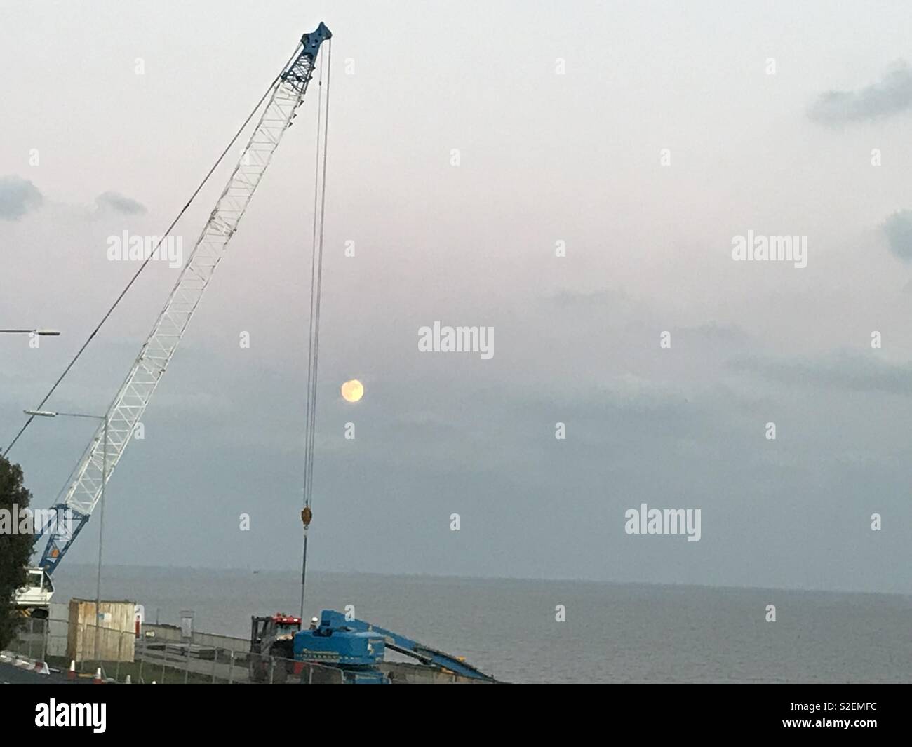 Moon and crane Stock Photo - Alamy