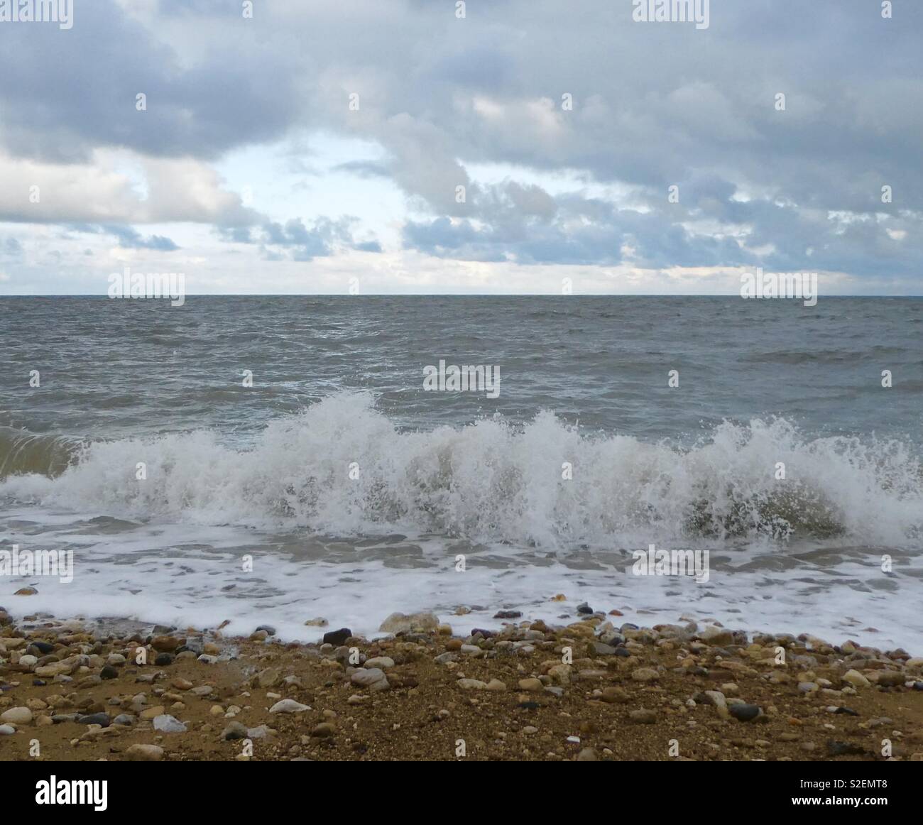 Waves breaking on beach hi-res stock photography and images - Alamy