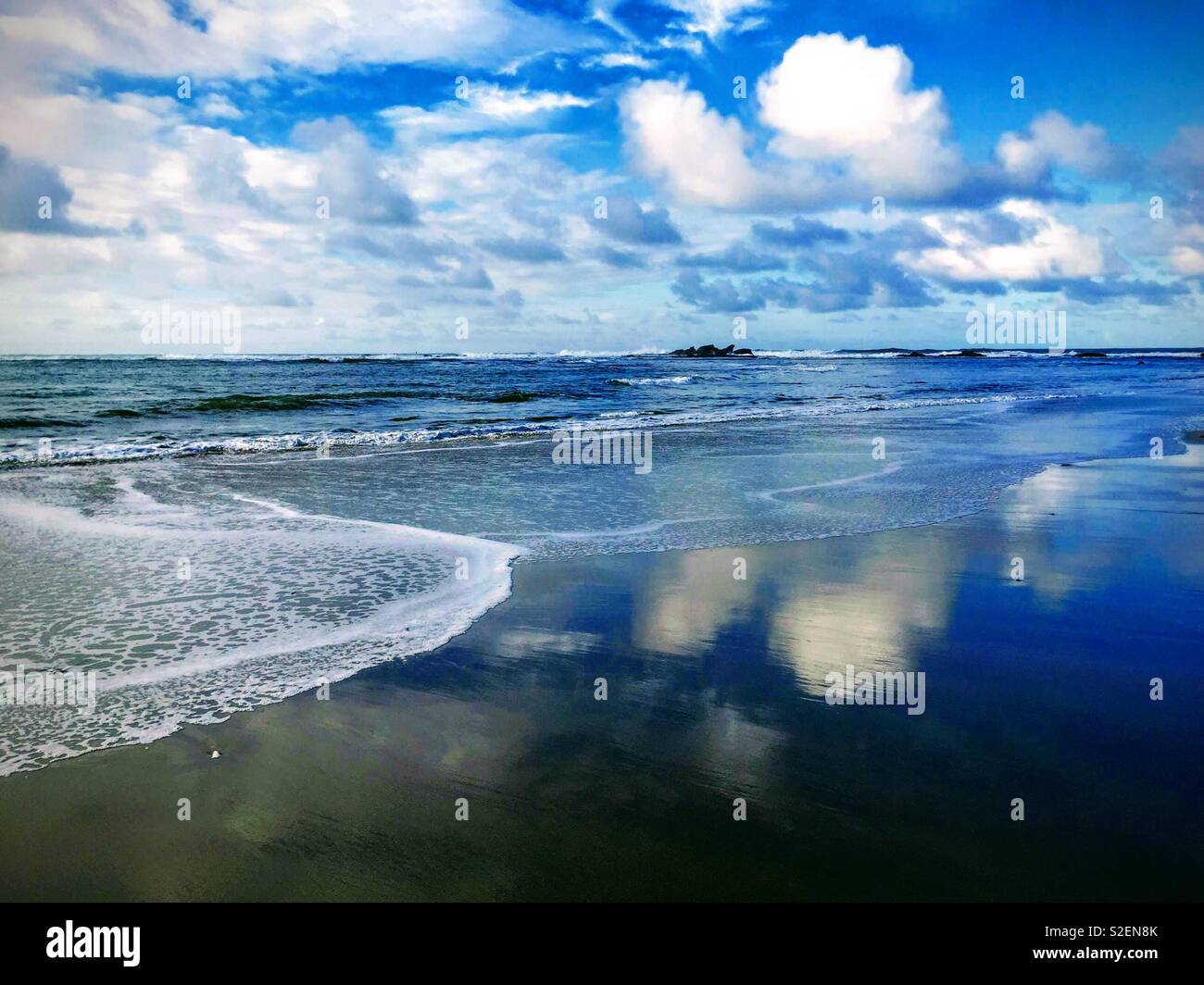 Reflections of clouds in water Stock Photo - Alamy