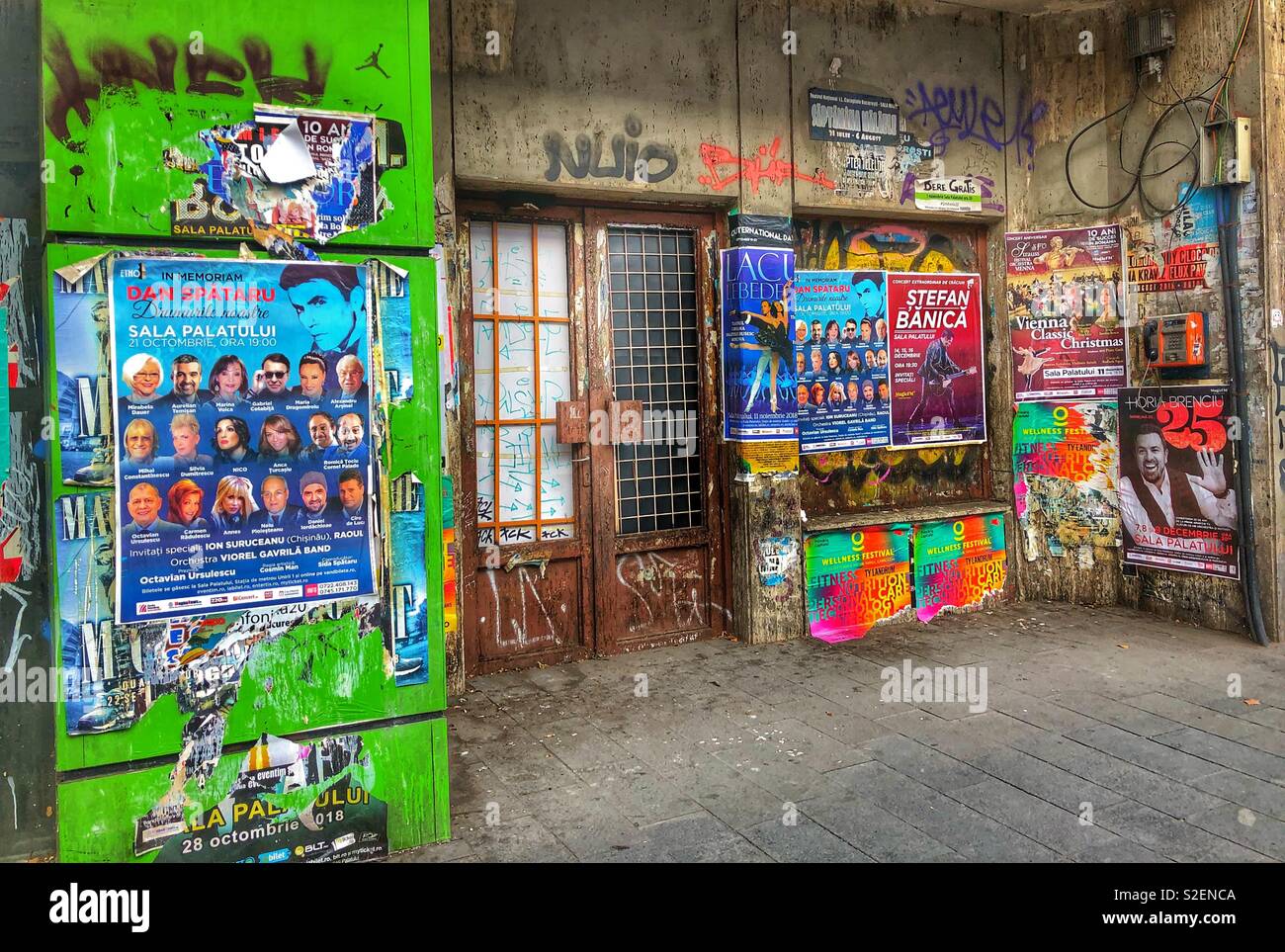 Building walls plastered with advertising posters Stock Photo - Alamy