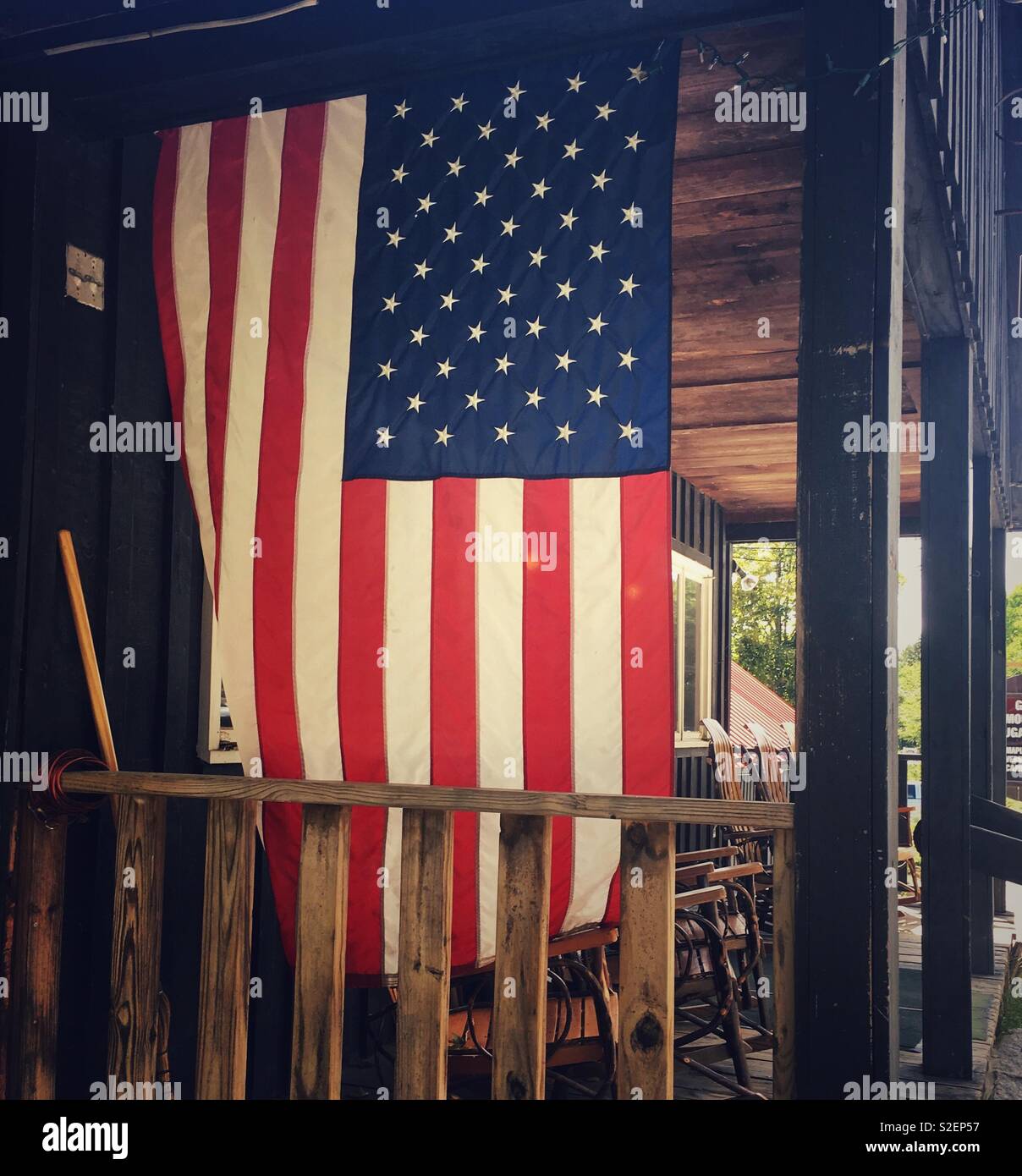 American Flag on Store Front Stock Photo - Alamy