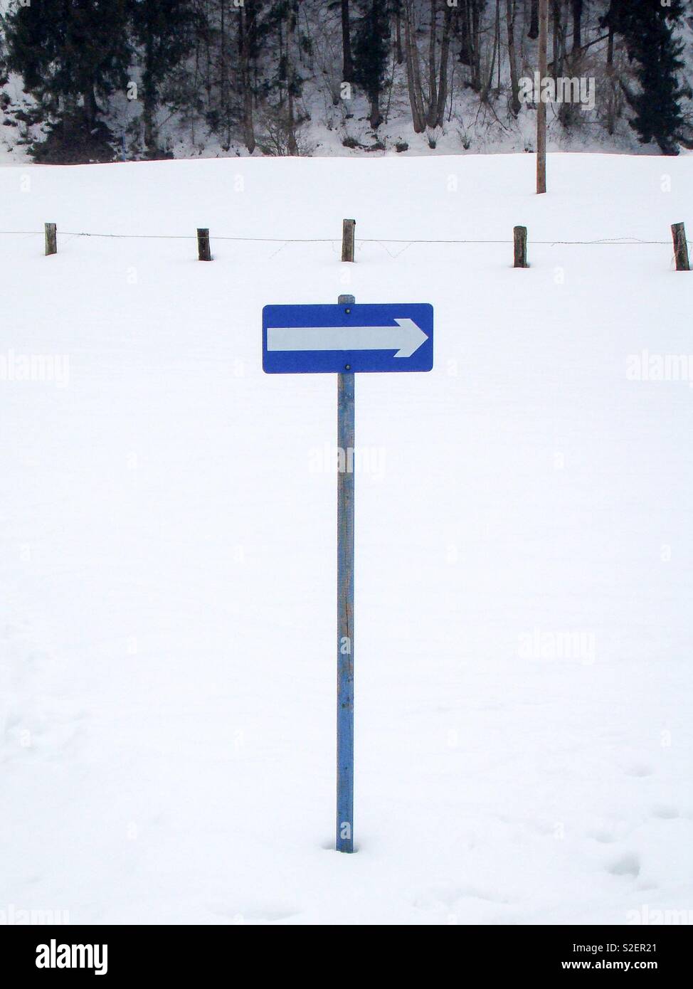 Blue traffic sign white arrow hi-res stock photography and images - Alamy