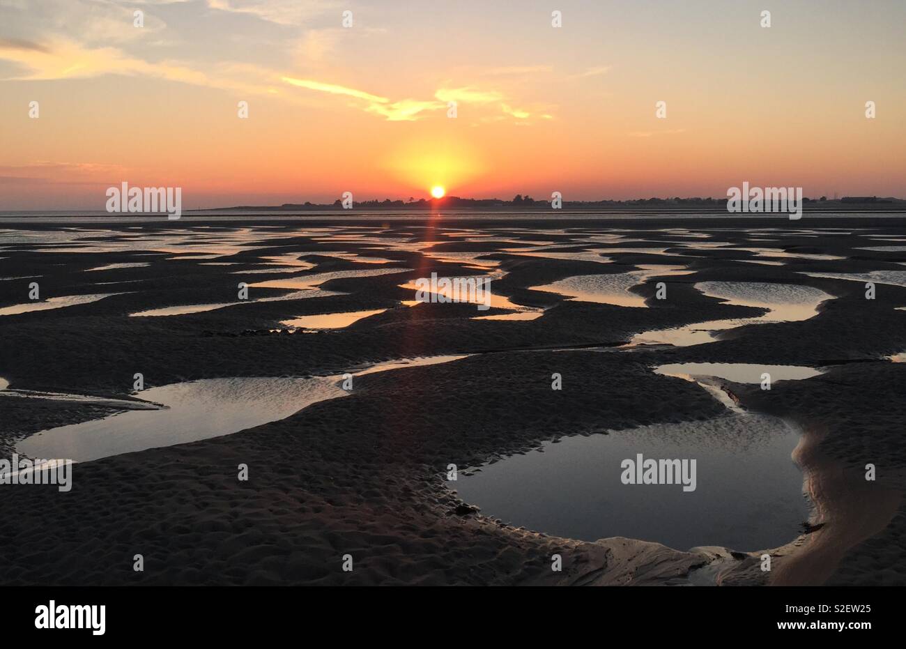 Beach Puddle Sunset Stock Photo - Alamy