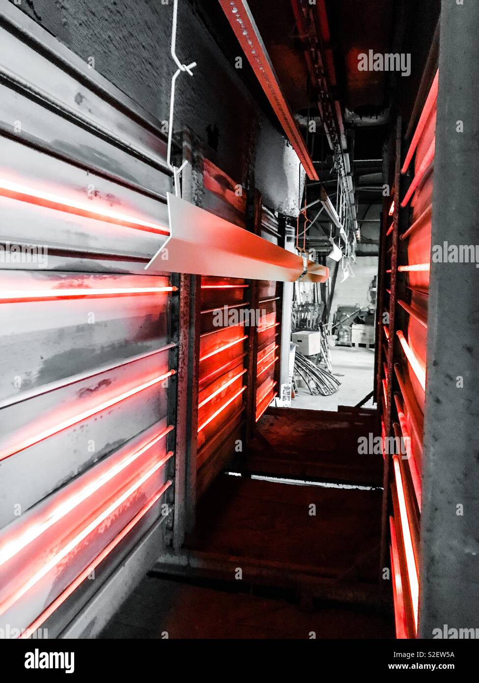 Painted panel going through an infrared heater to cure paint with ...