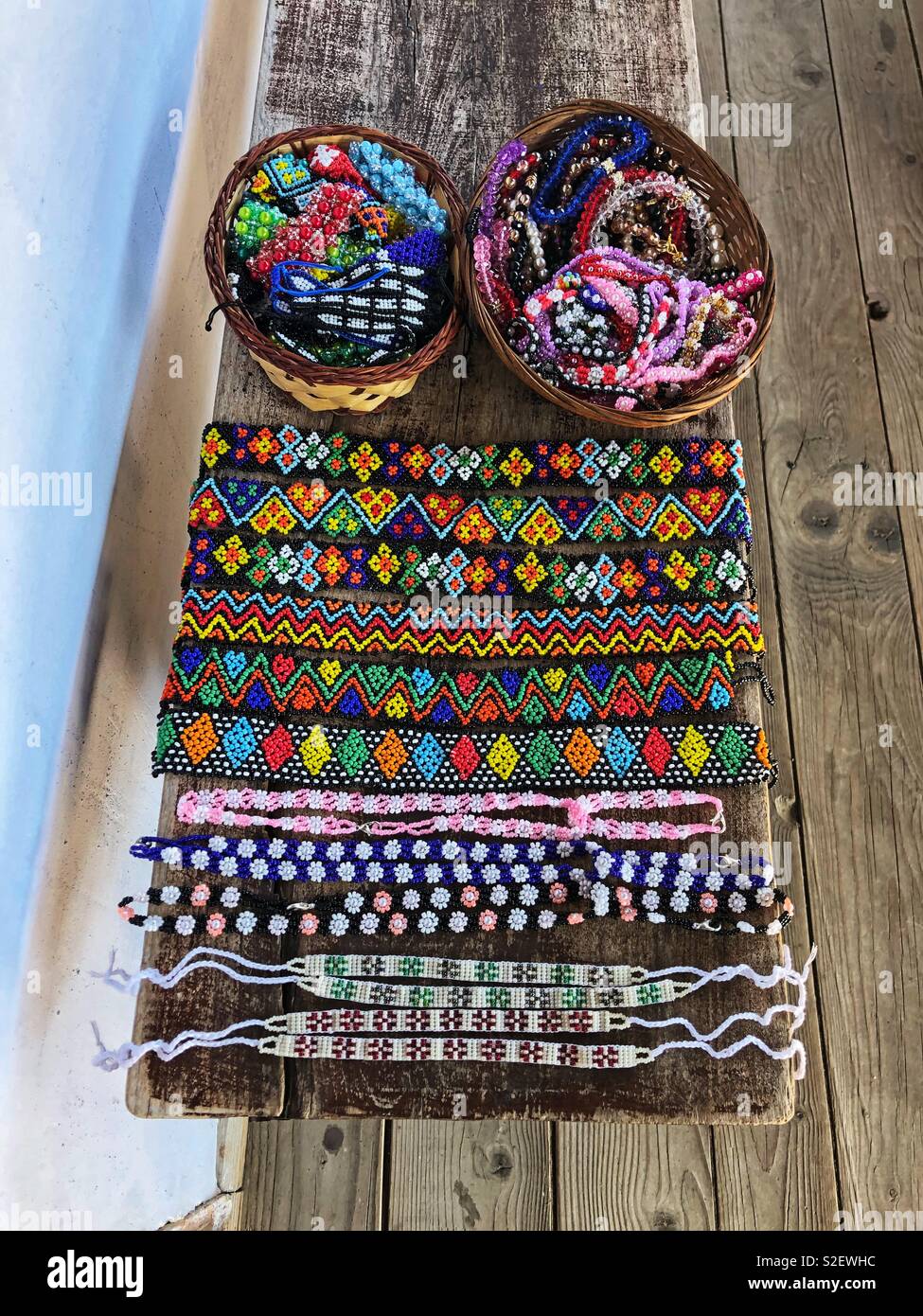 A collection of colourful handcrafted bead bracelets Stock Photo - Alamy
