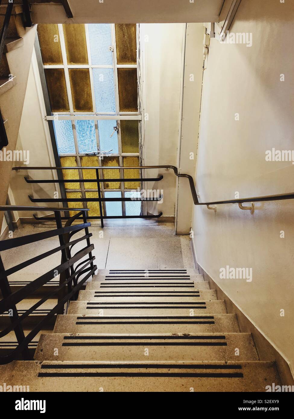 Classic vintage British institution staircase with cream dappled marble ...