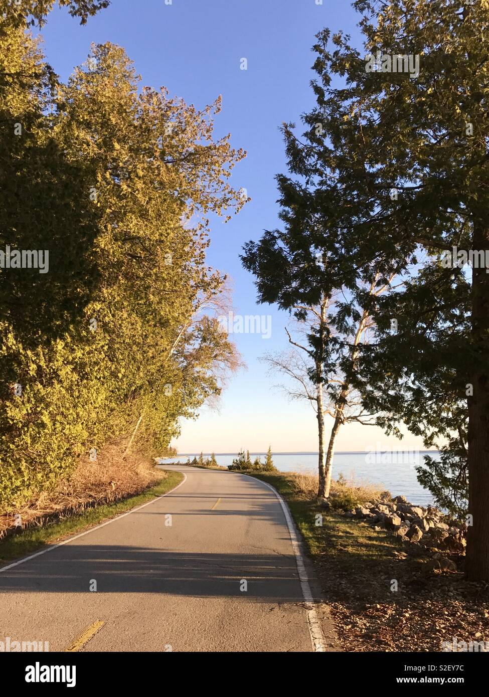 Mackinac Island bike path early morning Stock Photo - Alamy
