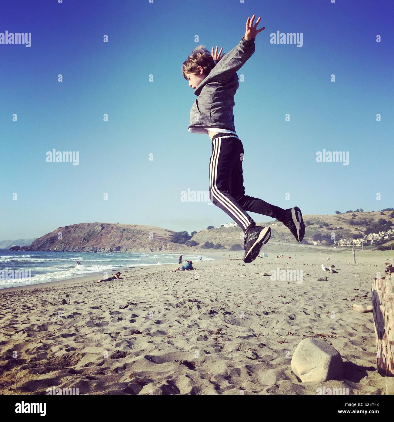 Jumping beach hi-res stock photography and images - Alamy