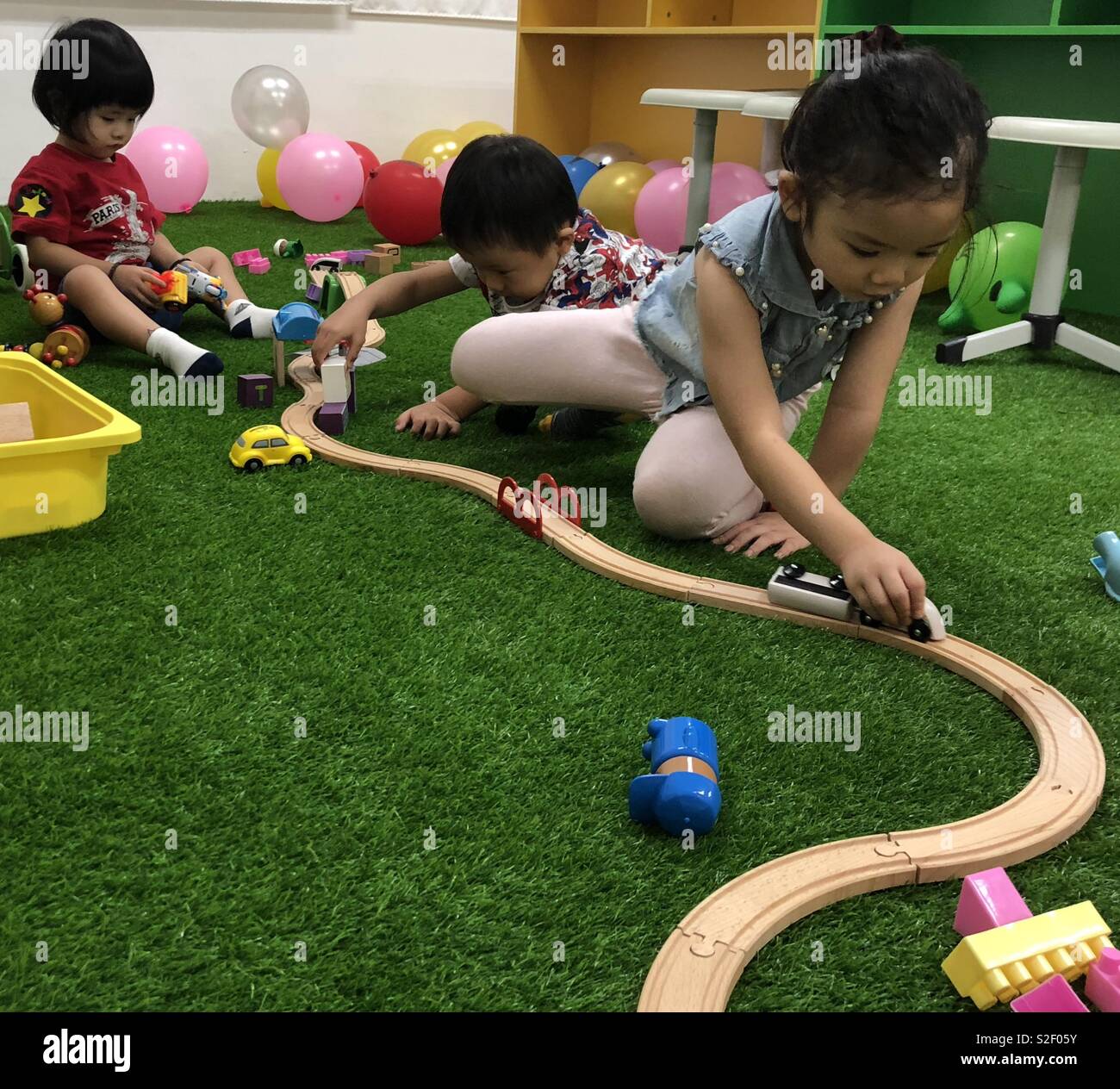 Children playing doo doo train Stock Photo - Alamy