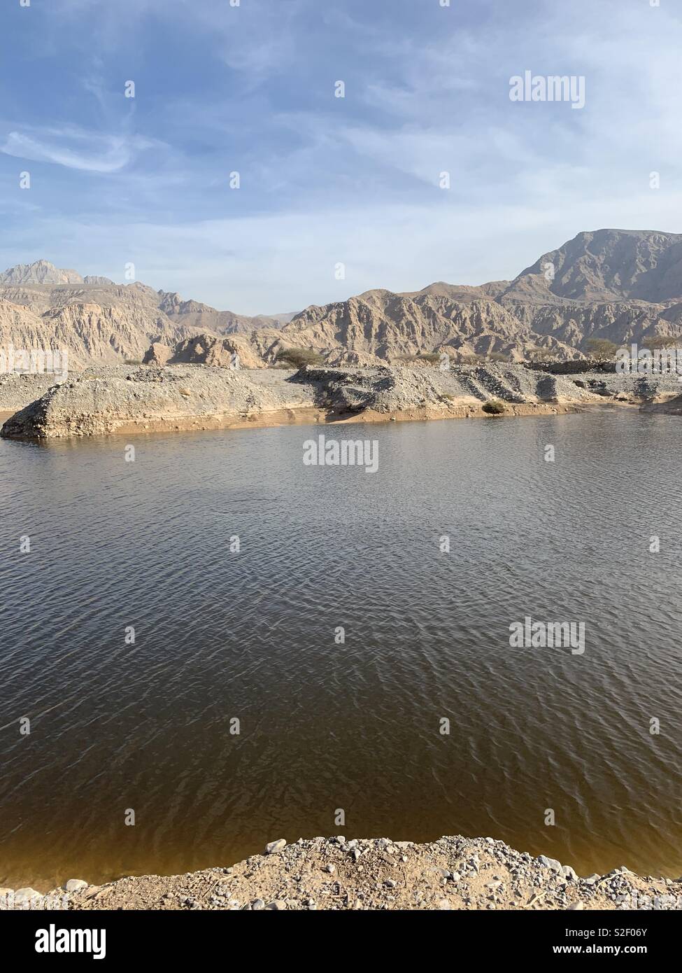 Hilly area with water Stock Photo - Alamy