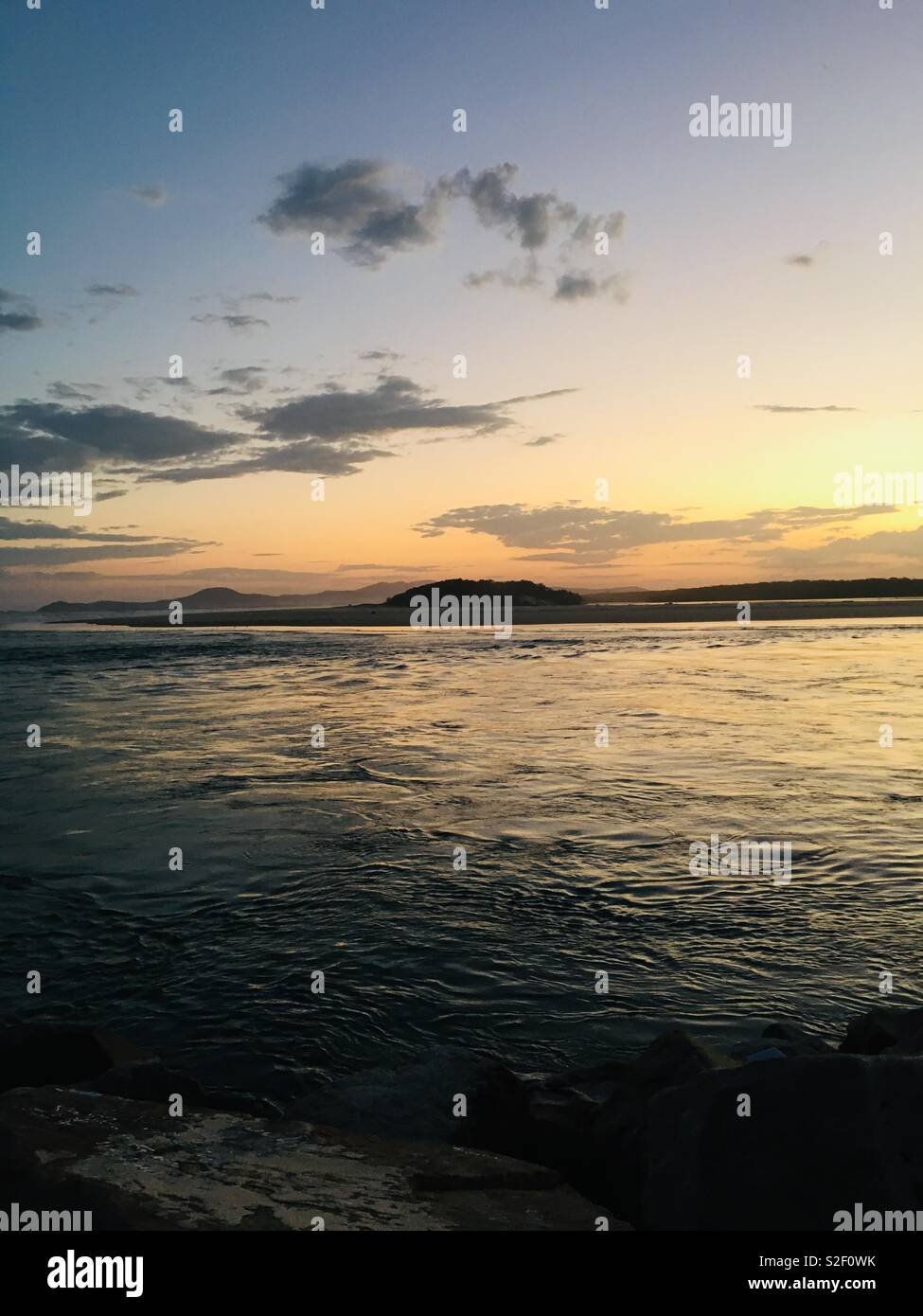 Calm sea with sunset hi-res stock photography and images - Alamy