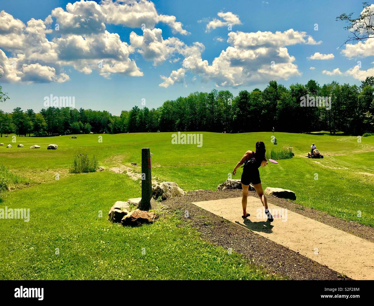 Disc golf in the summer. Litchfield, Maine, USA Stock Photo - Alamy