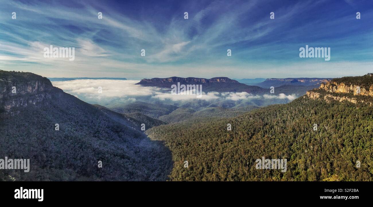 Morning mist burns off from the slopes of Mount Solitary and the ...