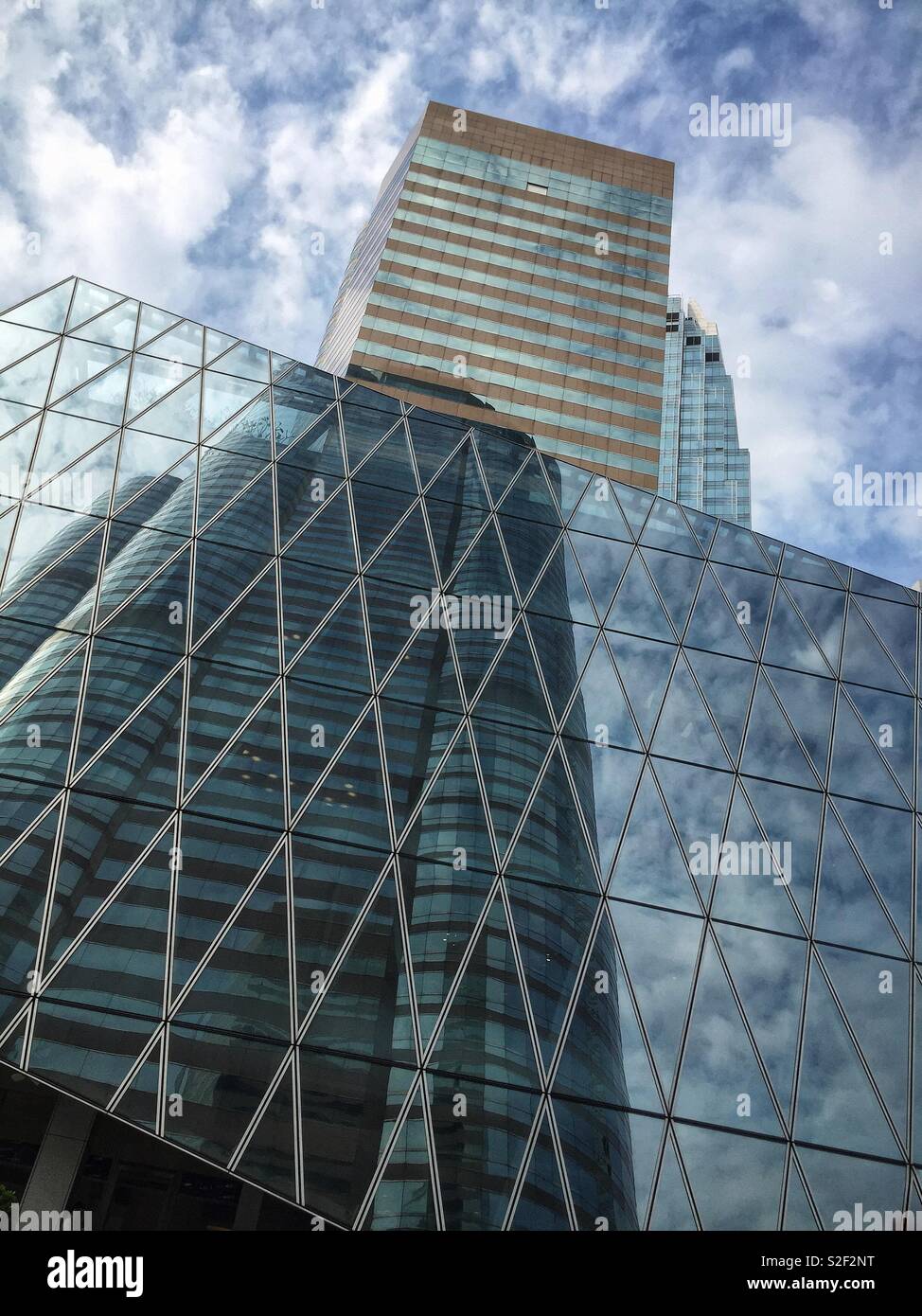 Two Exchange Square reflected in the glass facade of the Podium ...