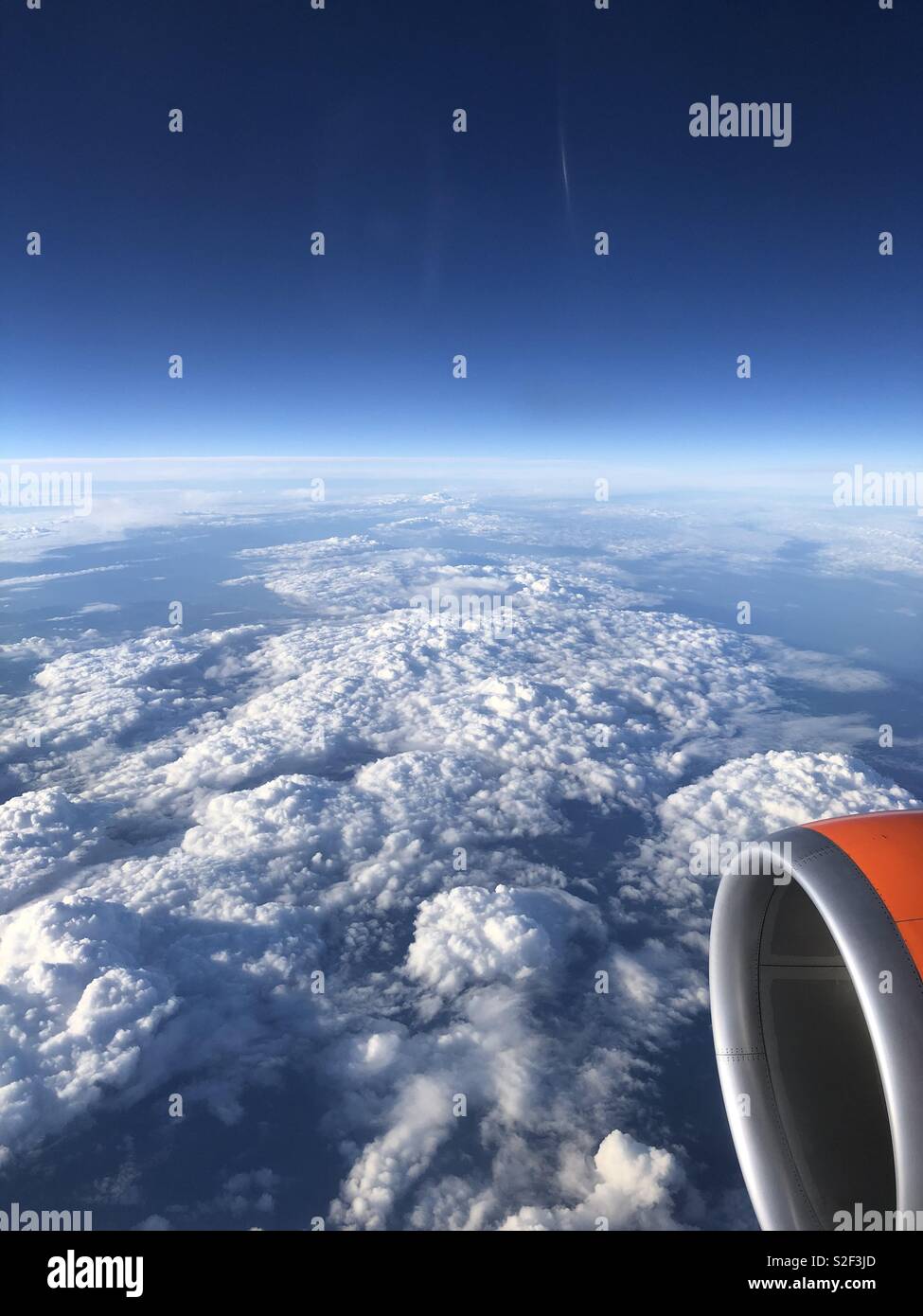 A view of the edge of the Earth from a a passenger jet Stock Photo - Alamy