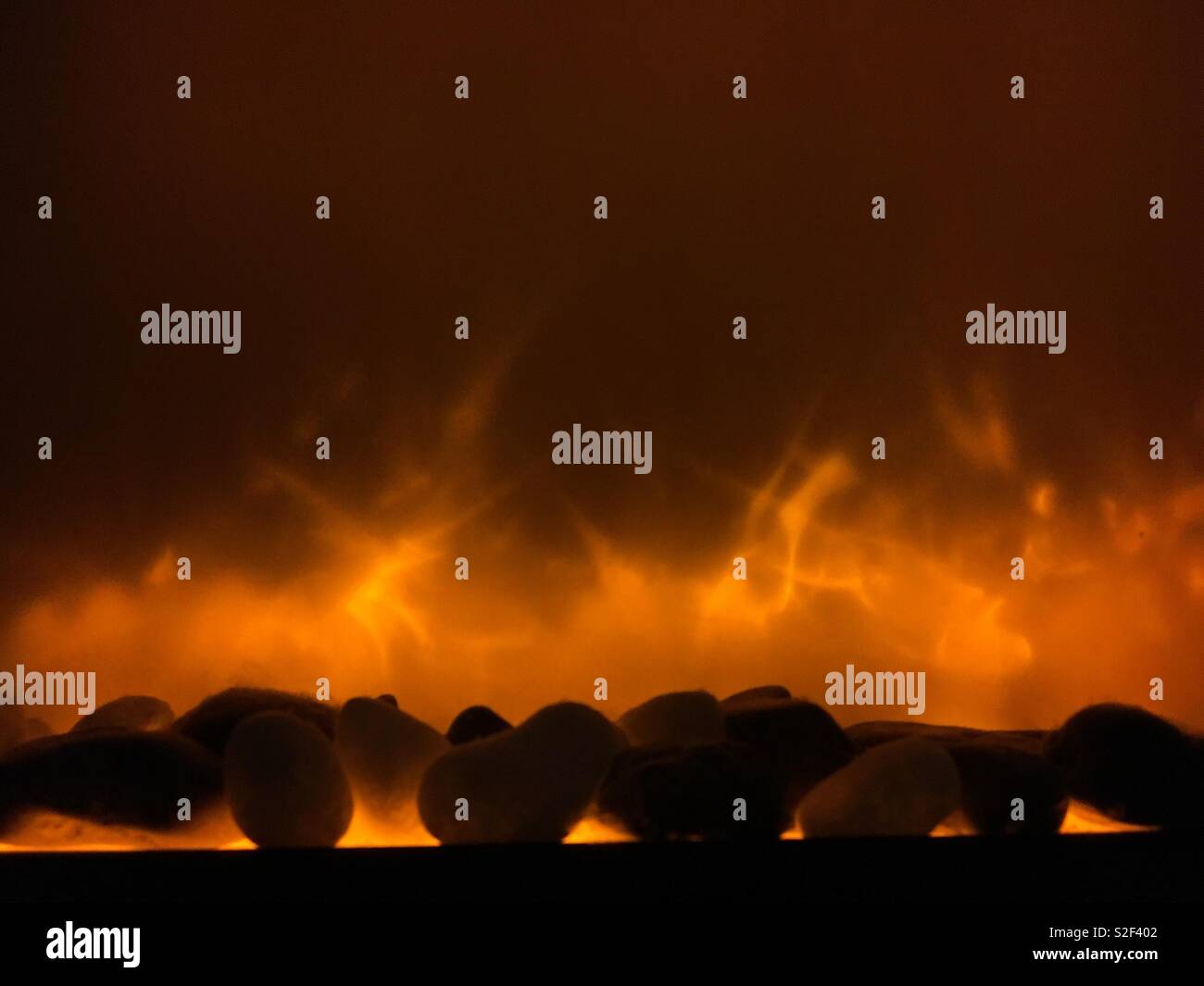 Fire on the rocks Stock Photo - Alamy