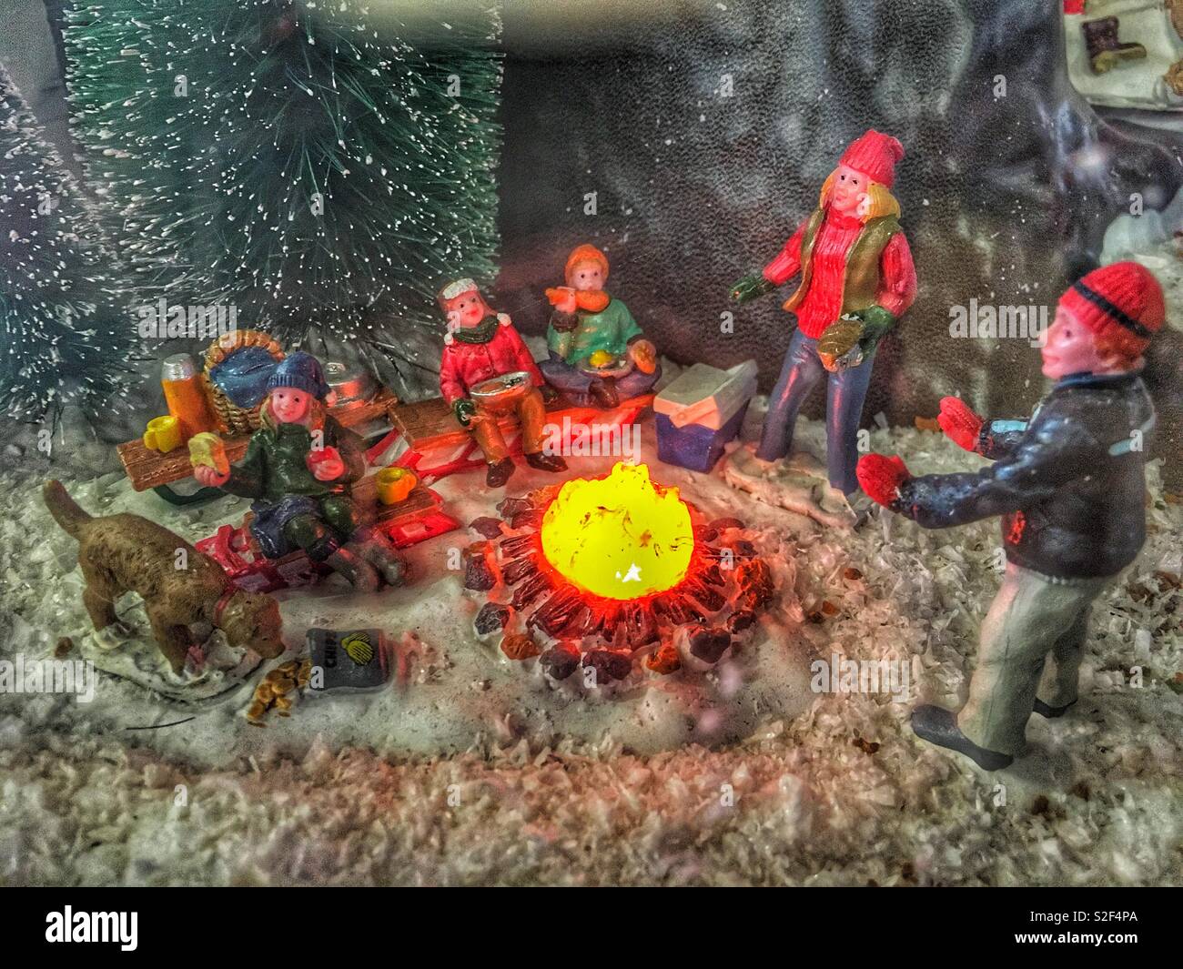 Christmas village campfire scene Stock Photo - Alamy