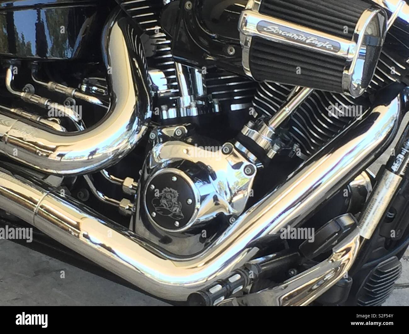 Chromed pipes from a motorbike Stock Photo - Alamy