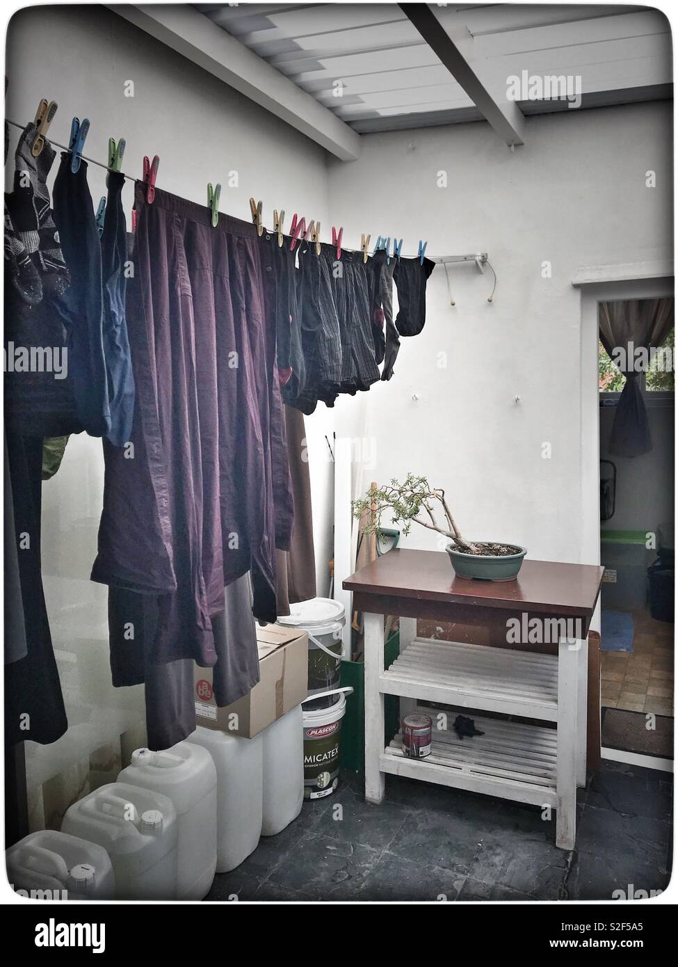 Clothes hanging on a washing line Stock Photo - Alamy