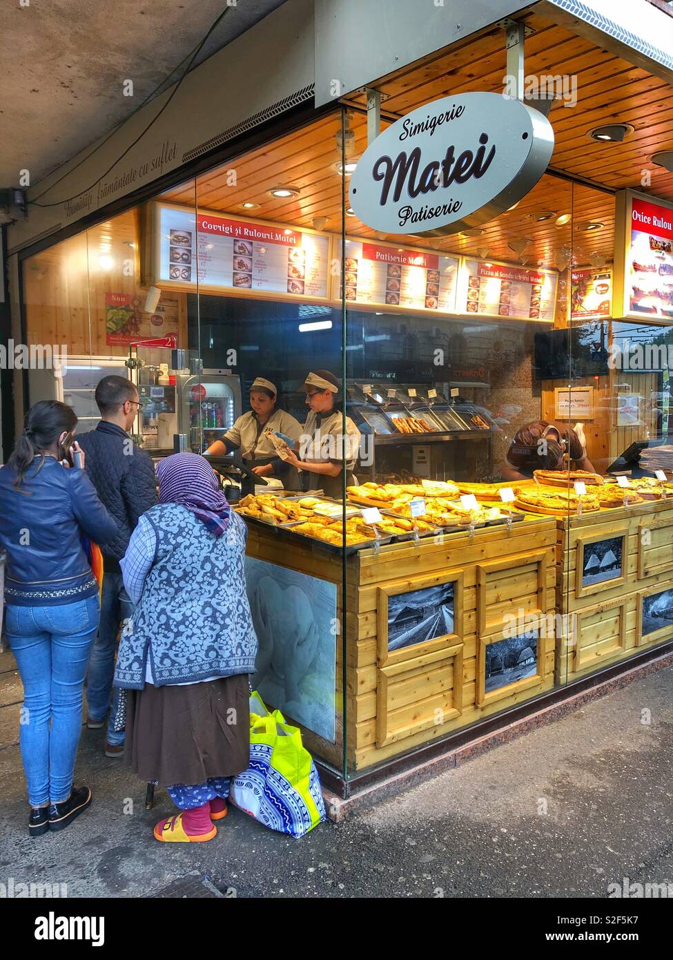 People lined up outside a bakery in Bucharest, Romania Stock Photo - Alamy