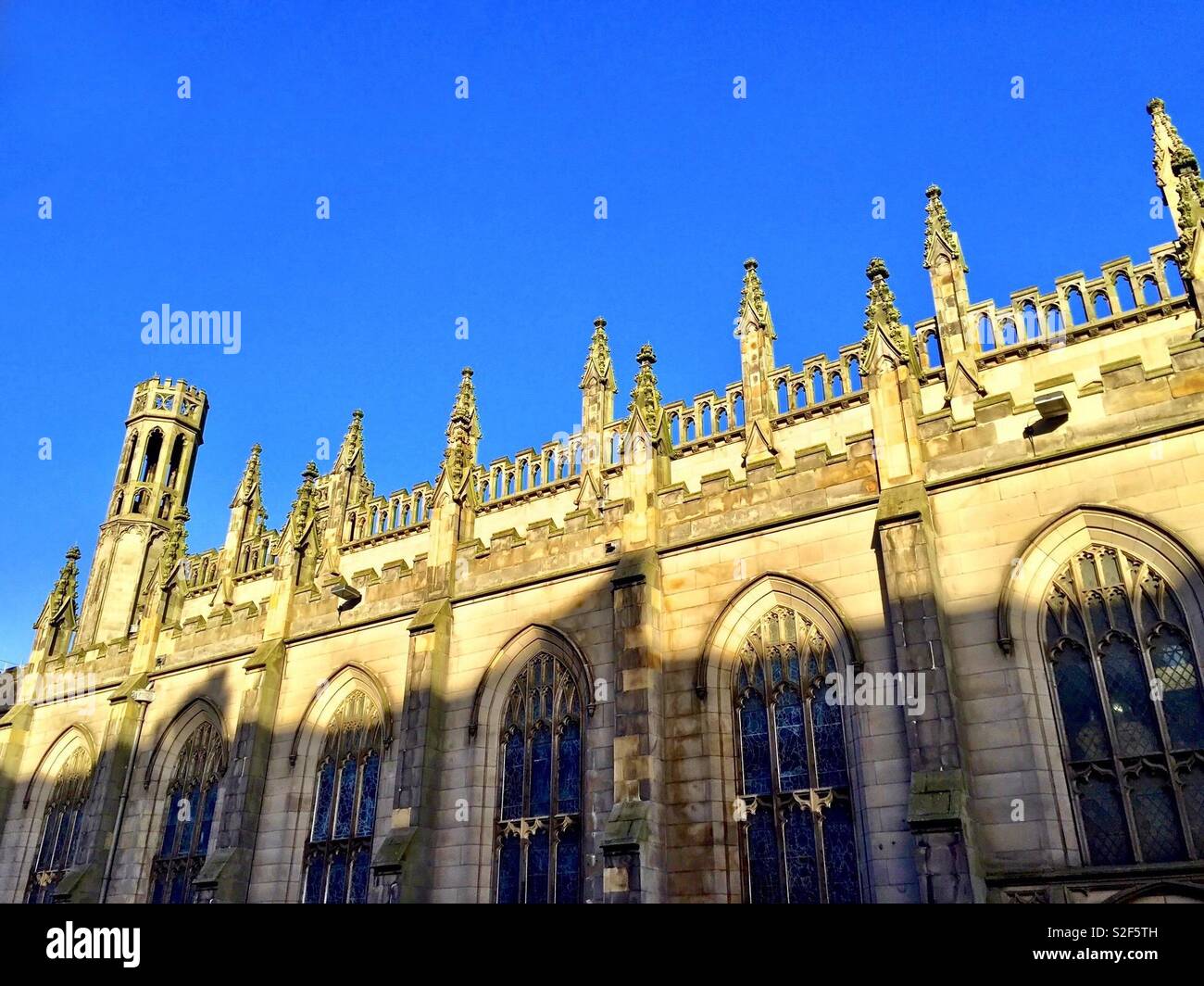 Sunlight blue sky cathedral Stock Photo - Alamy