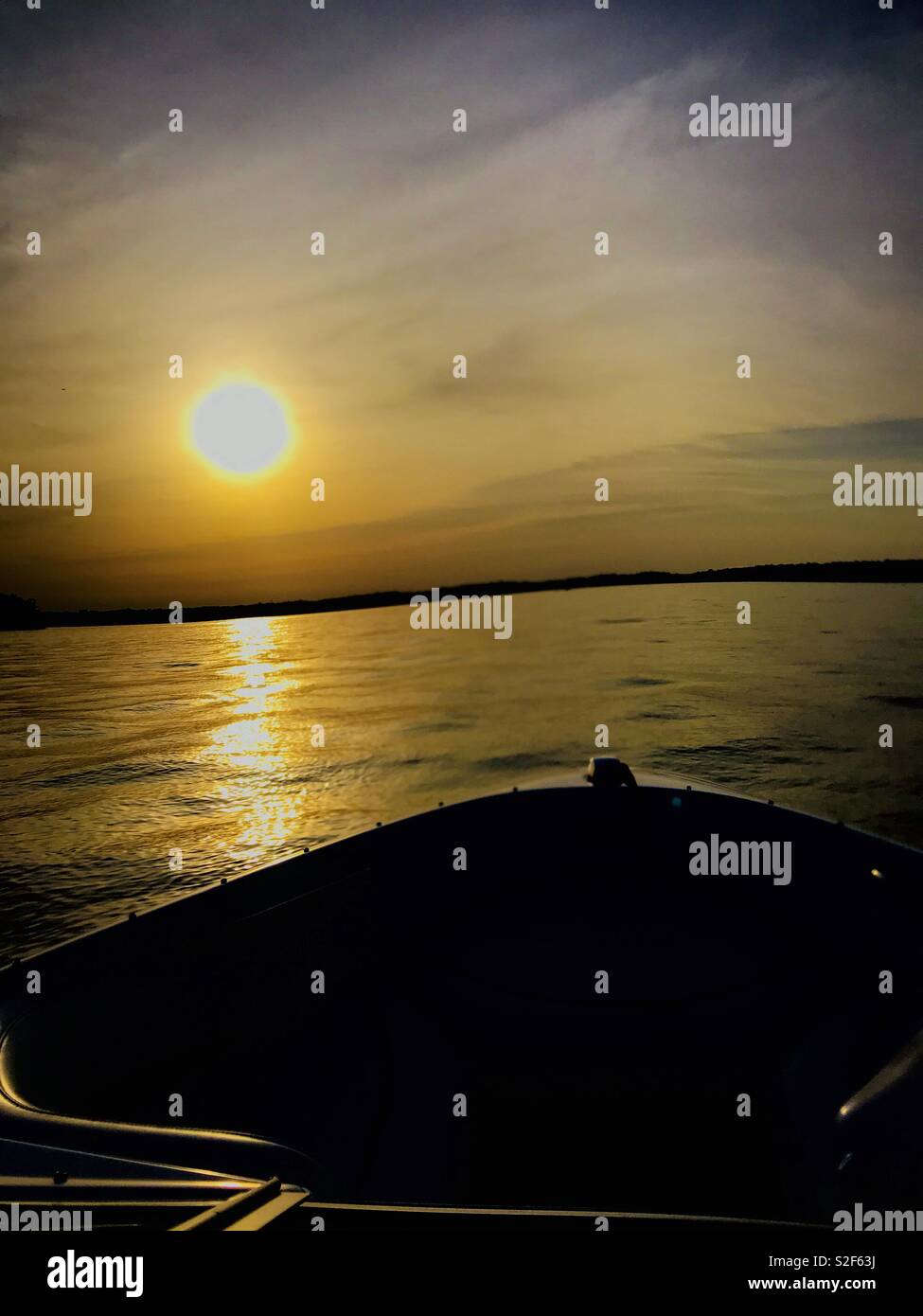 Sunset view from a boat Stock Photo - Alamy