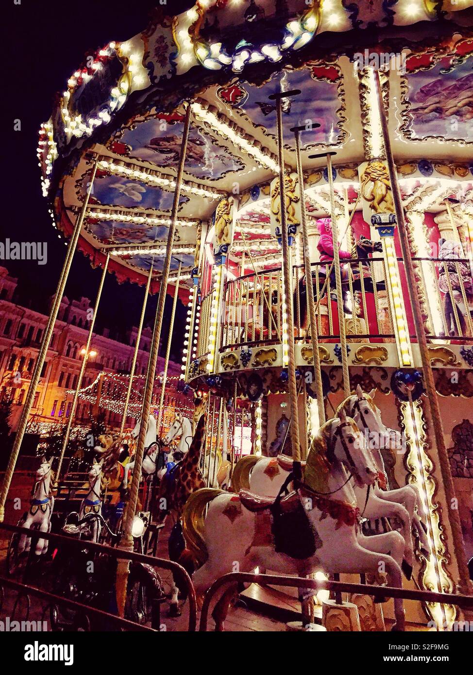 Carousel in night city Stock Photo - Alamy