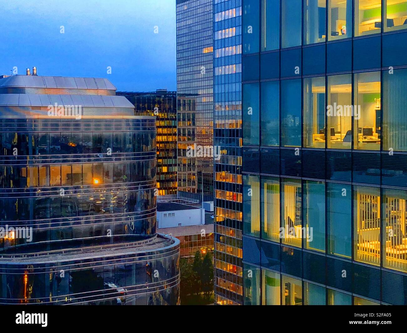 Different layers of business office windows at Dusk or dawn, showing ...