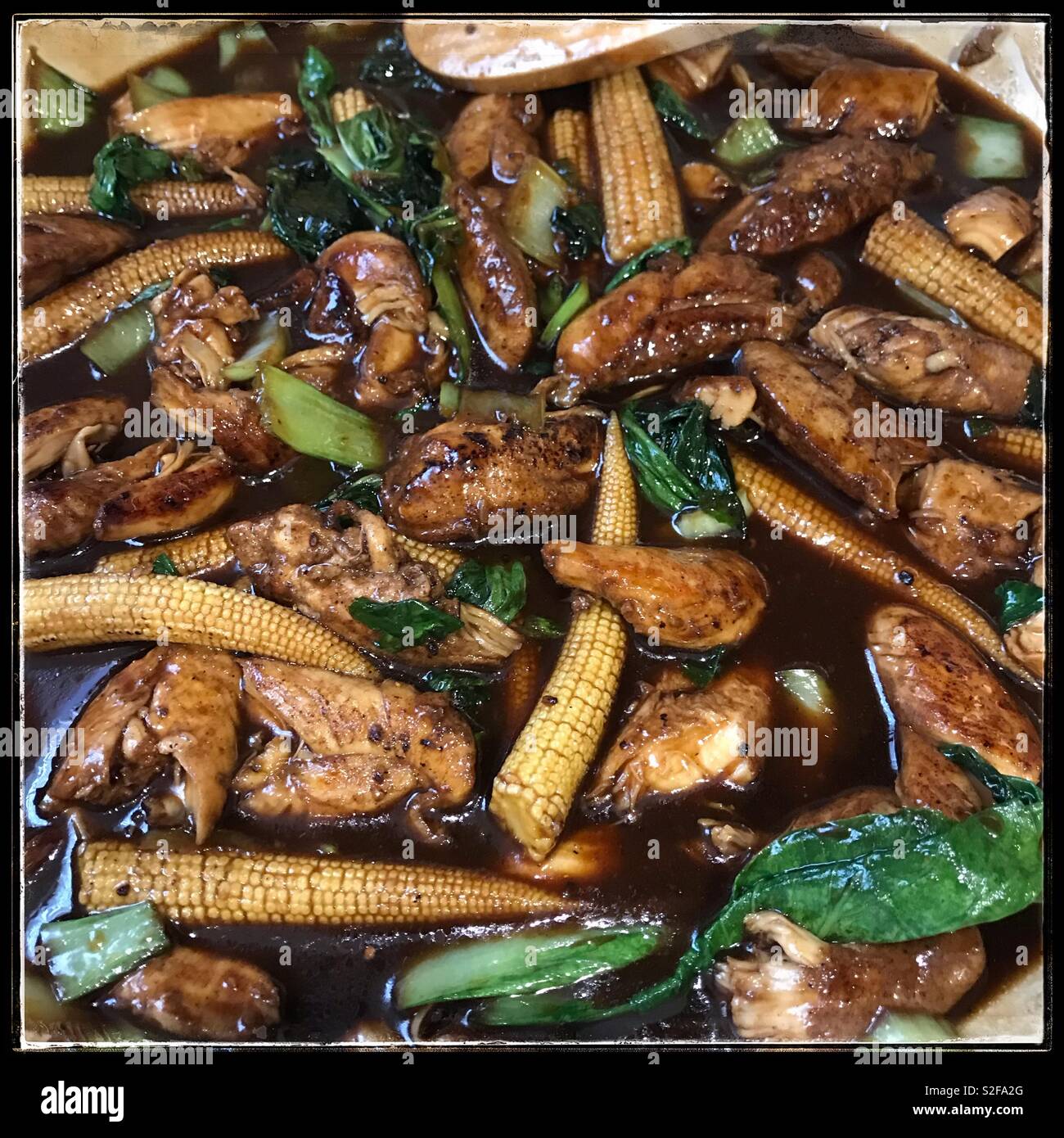 Chinese chicken with baby corn Stock Photo - Alamy