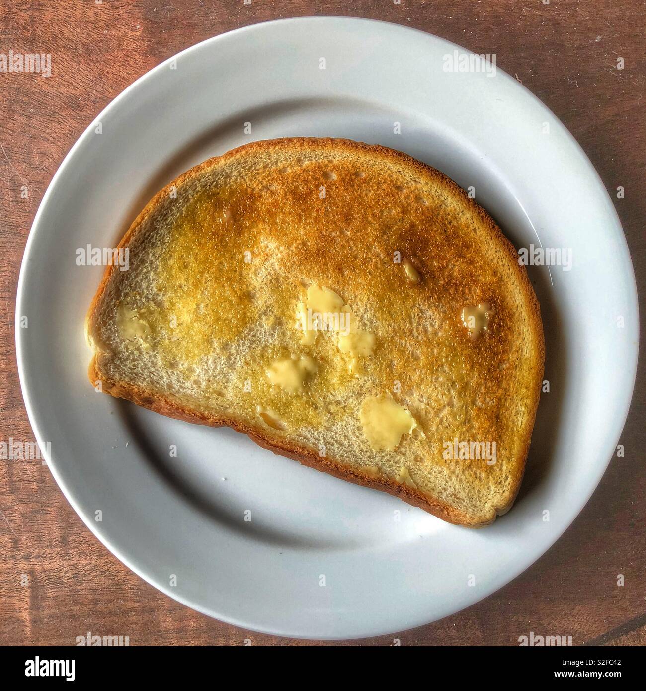 Buttered white toast Stock Photo - Alamy