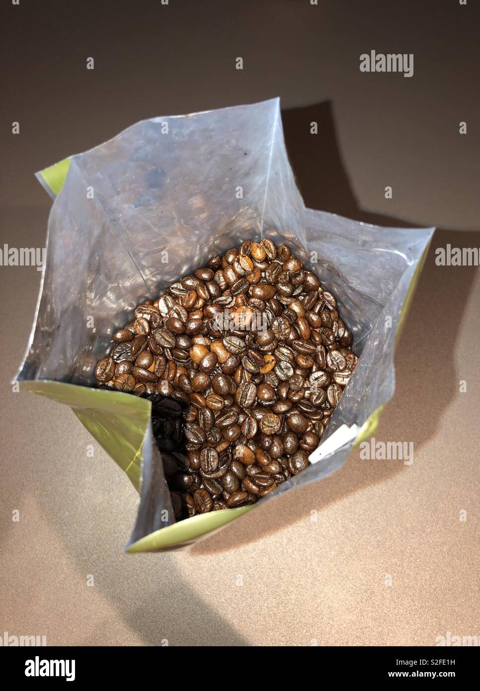 Open bag of freshly roasted coffee beans Stock Photo - Alamy