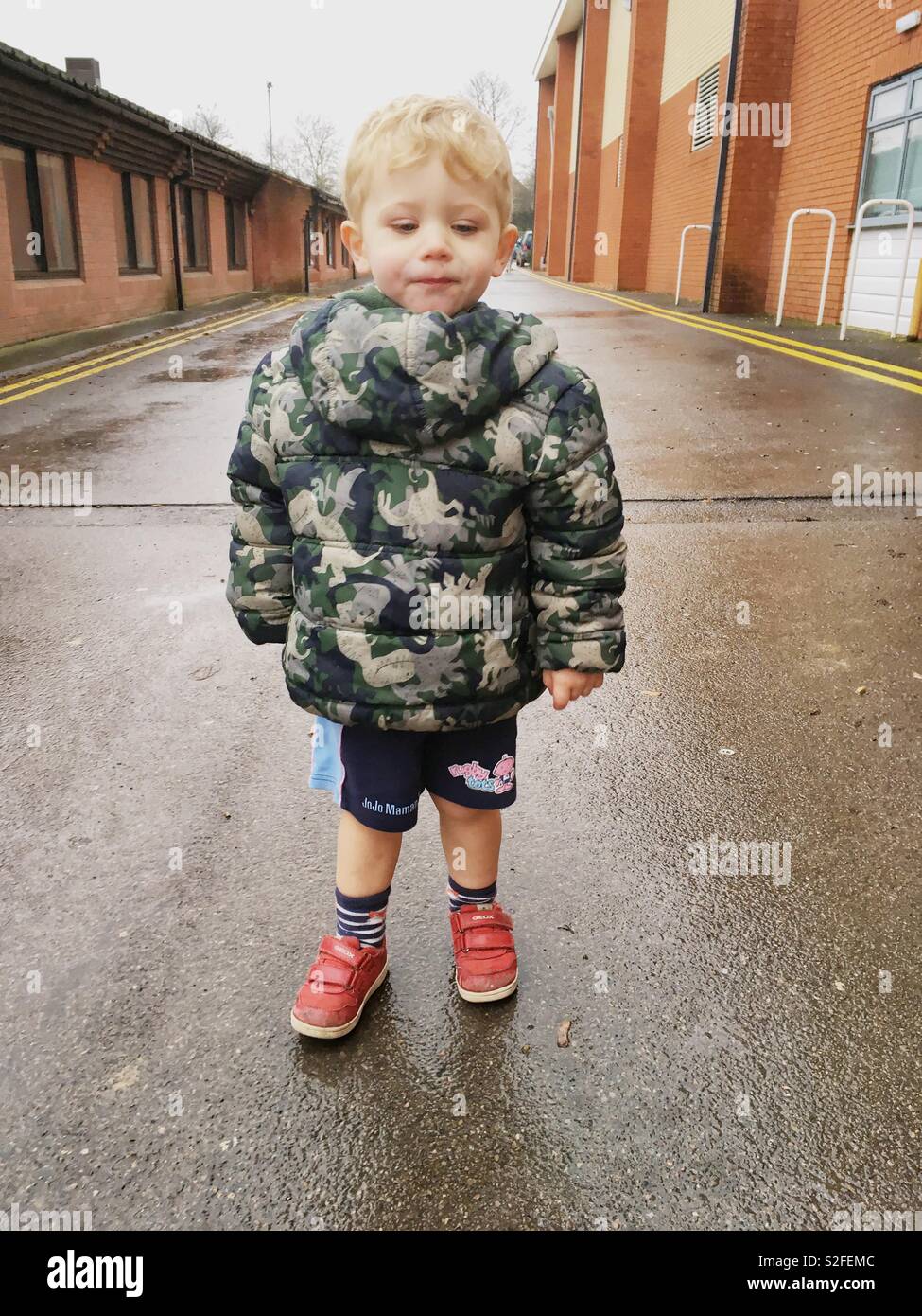 Two year old boy wearing his jacket the wrong way round. Hampshire ...