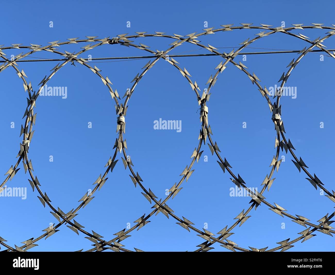Abstract image of some security fencing Stock Photo - Alamy