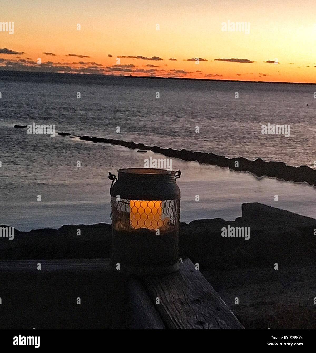 Candle by the sea Stock Photo - Alamy