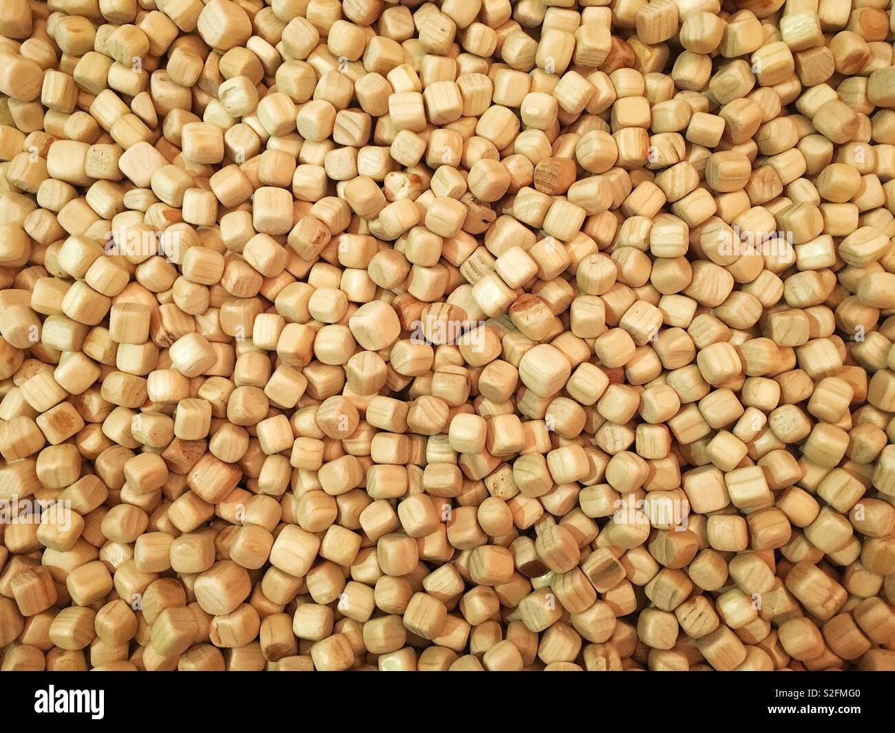 Tiny wooden cubes texture background Stock Photo - Alamy