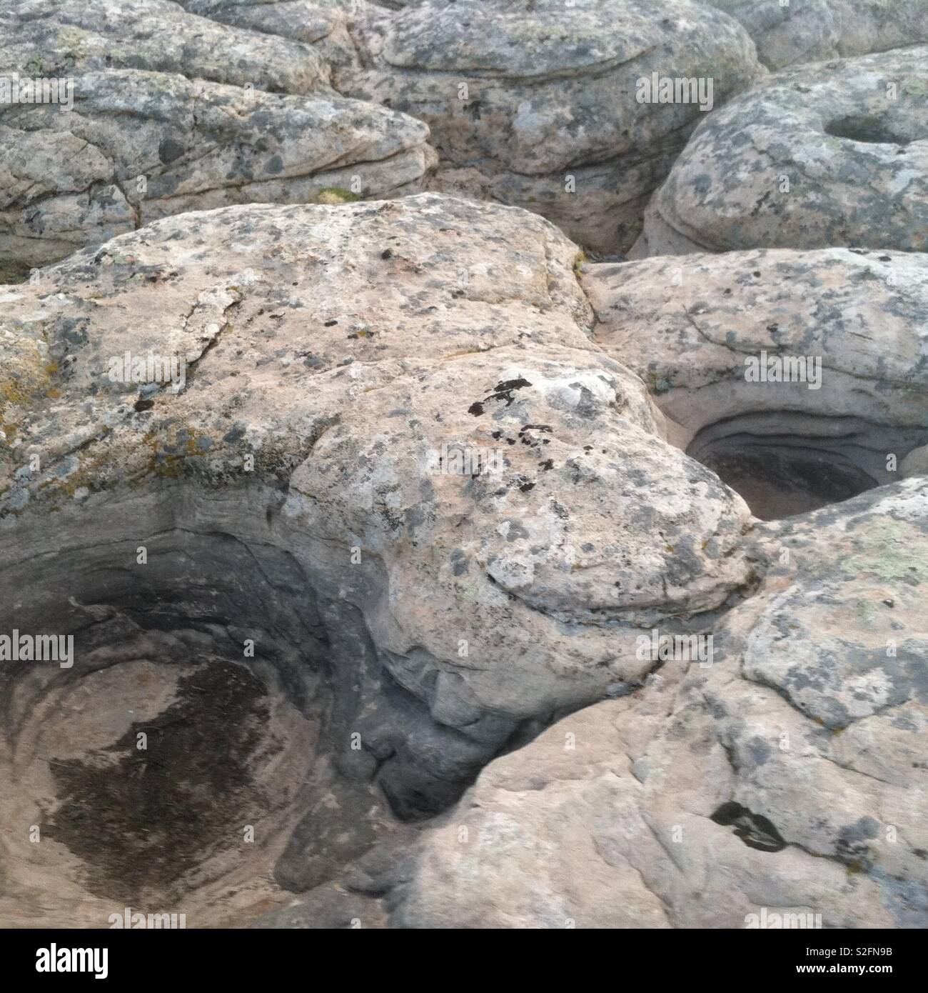 Scour holes 2 Stock Photo - Alamy